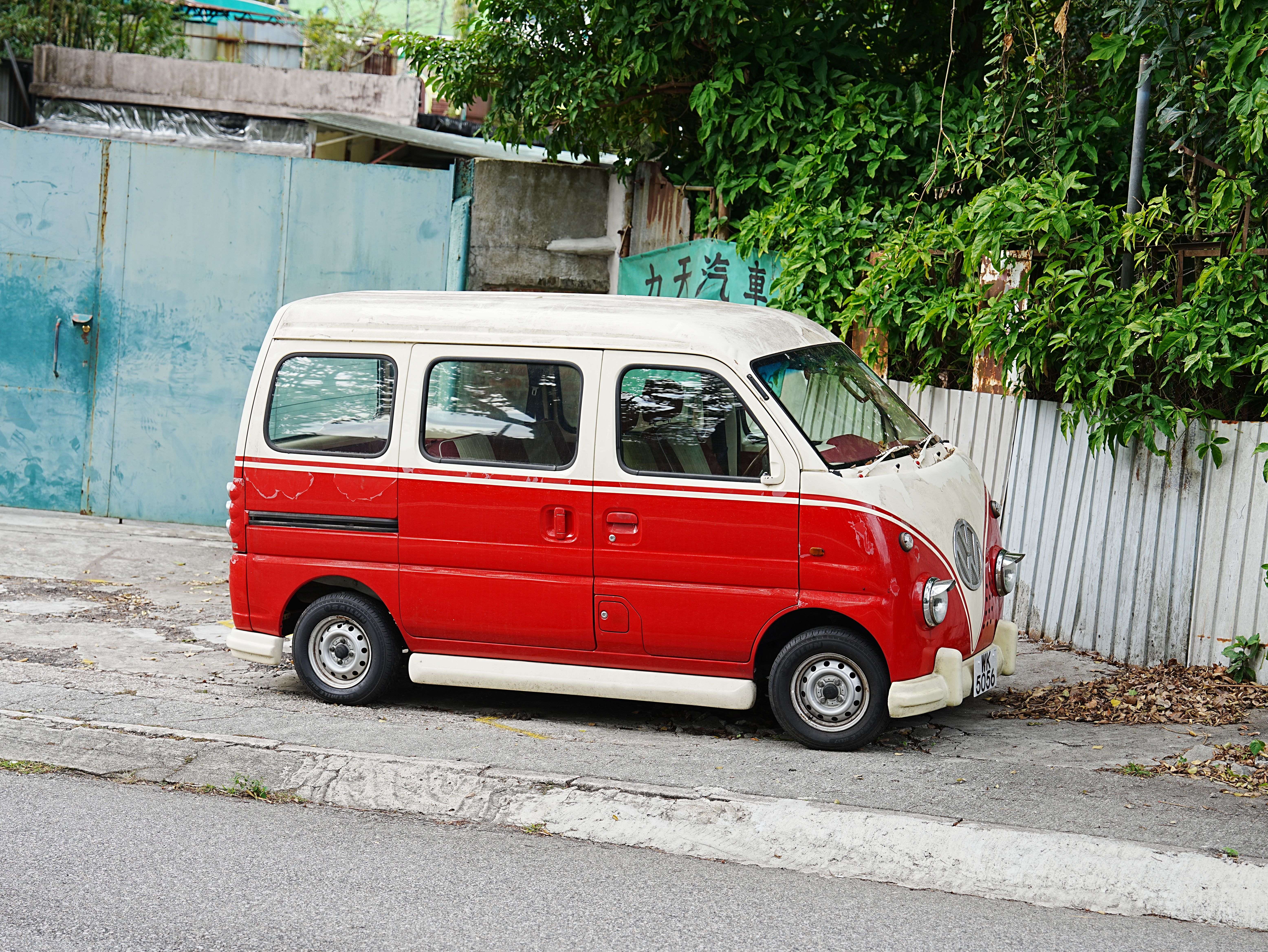 Vintage Red and White Van Parked Outdoors · Free Stock Photo