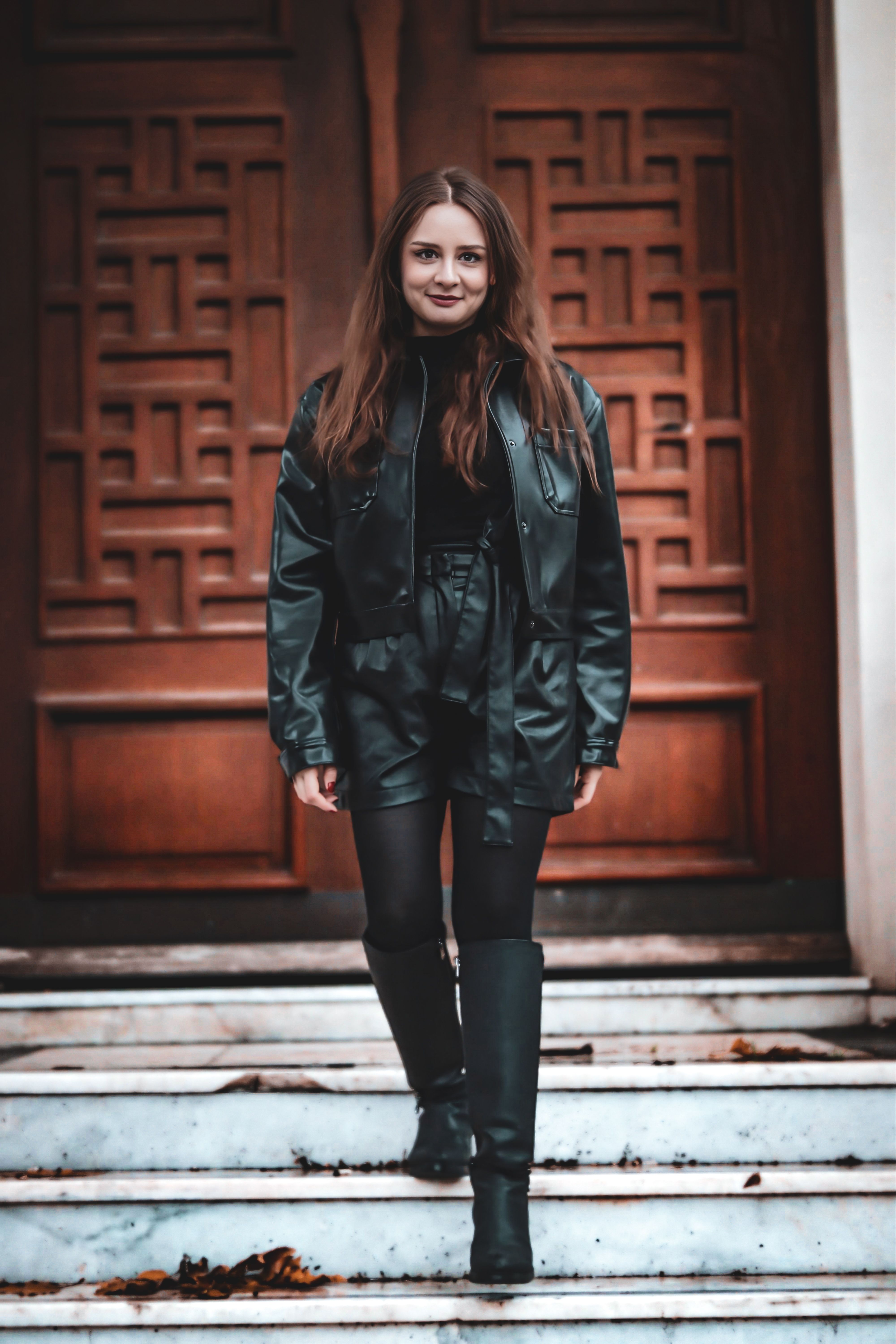 Fashionable Woman in Black Outfit on Marble Steps · Free Stock Photo