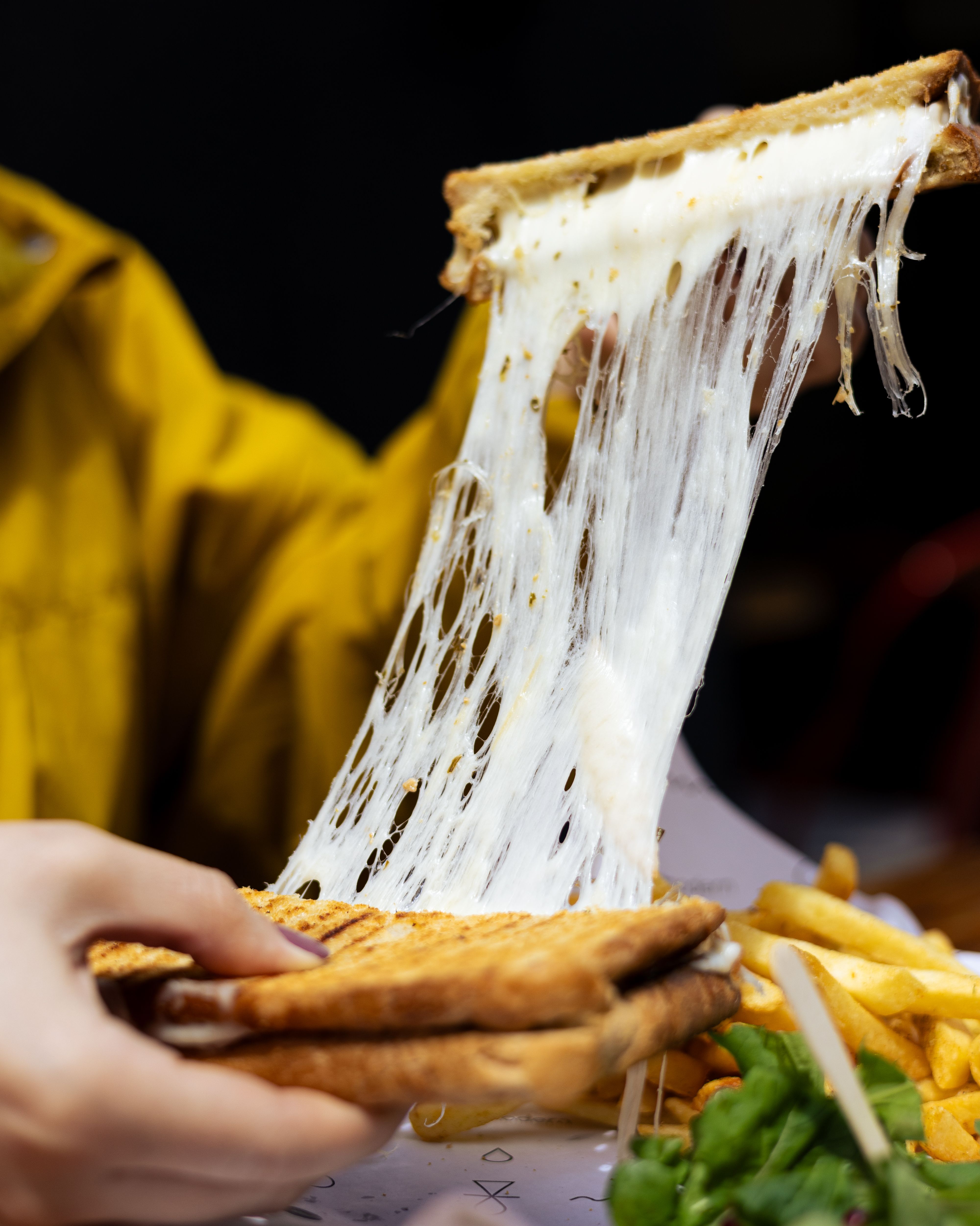 Melted Cheese Pull from Grilled Sandwich · Free Stock Photo