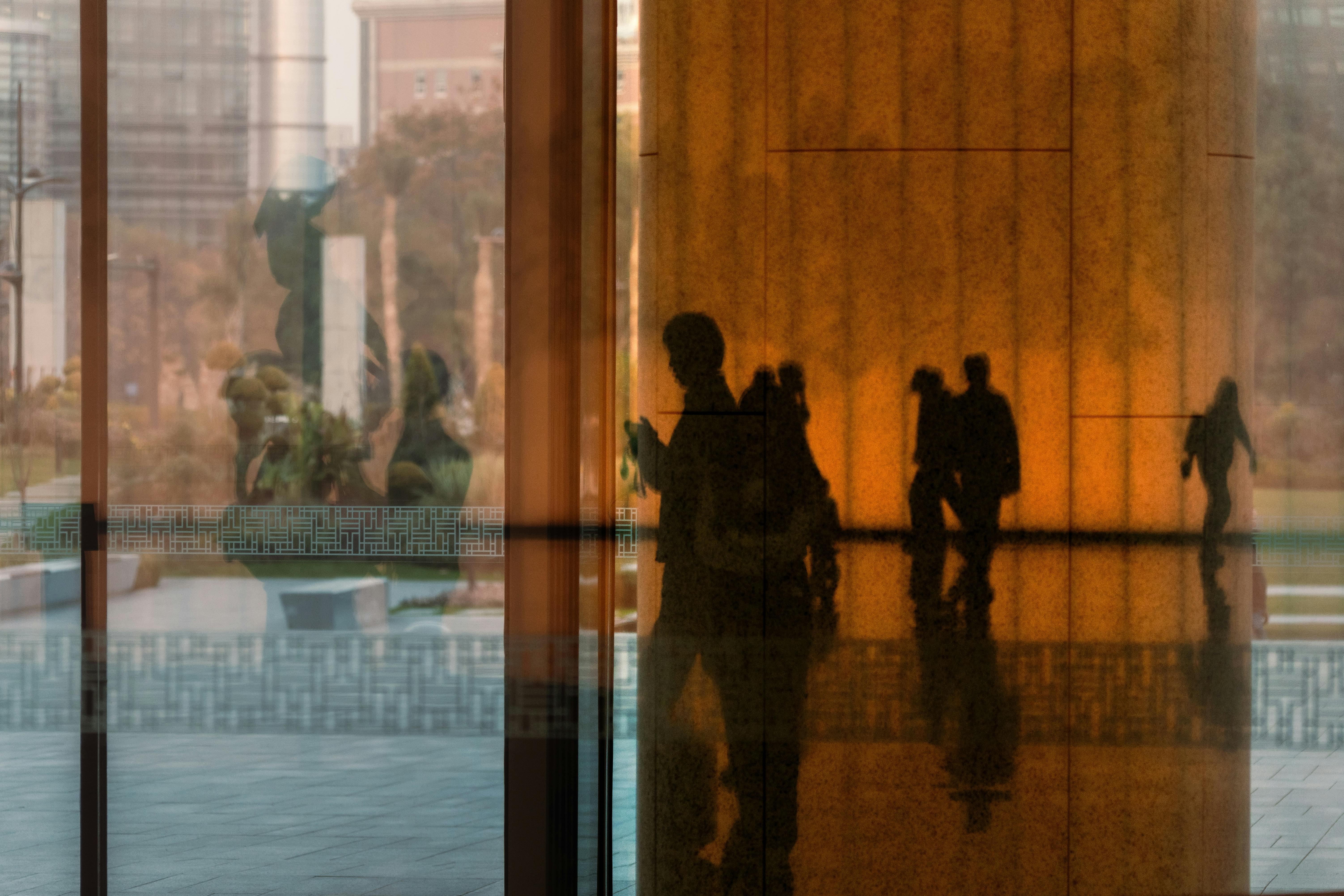 Abstract Reflection of City Life with Shadows · Free Stock Photo
