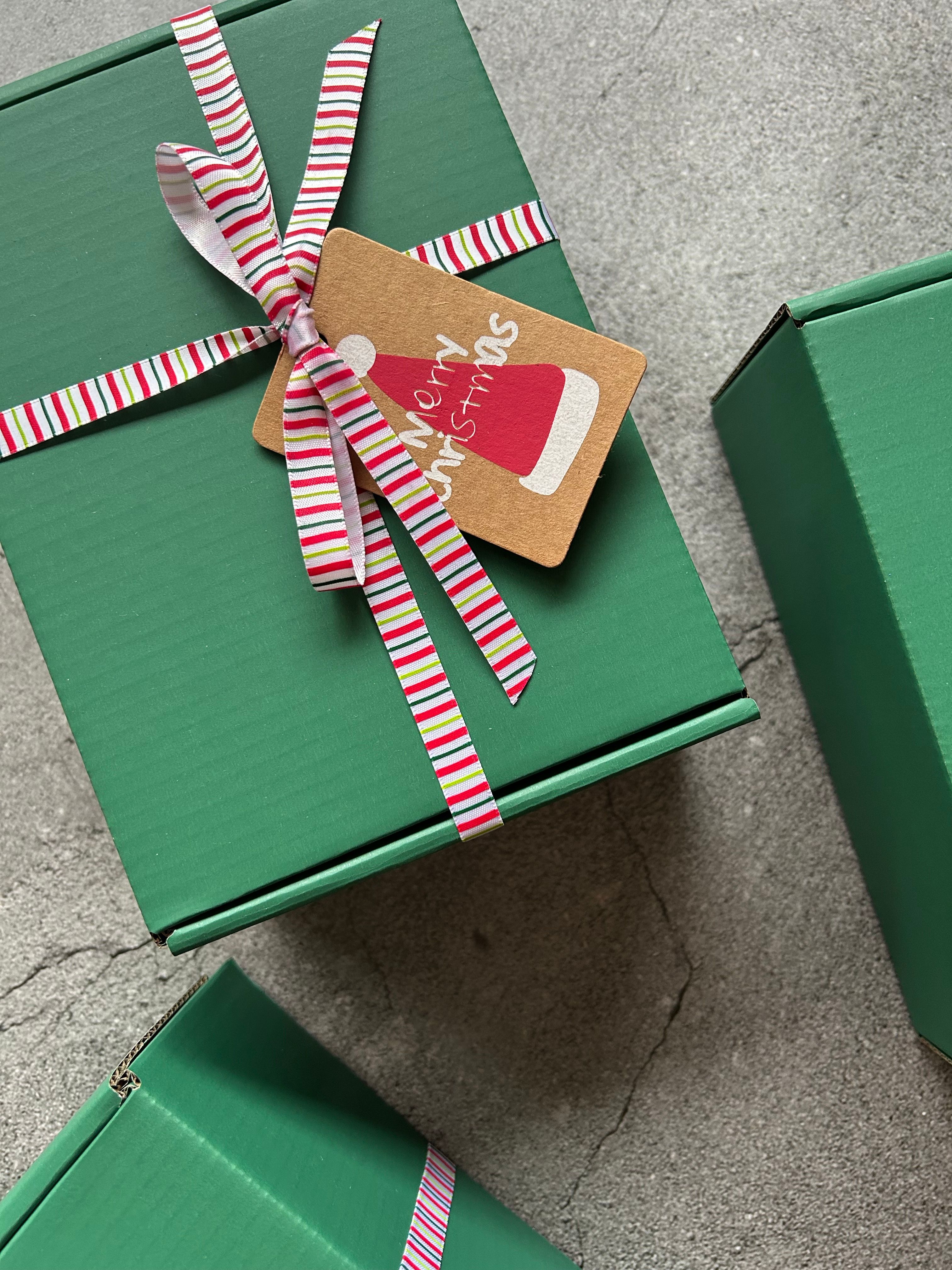 Green Gift Boxes with Christmas Tag and Ribbon · Free Stock Photo