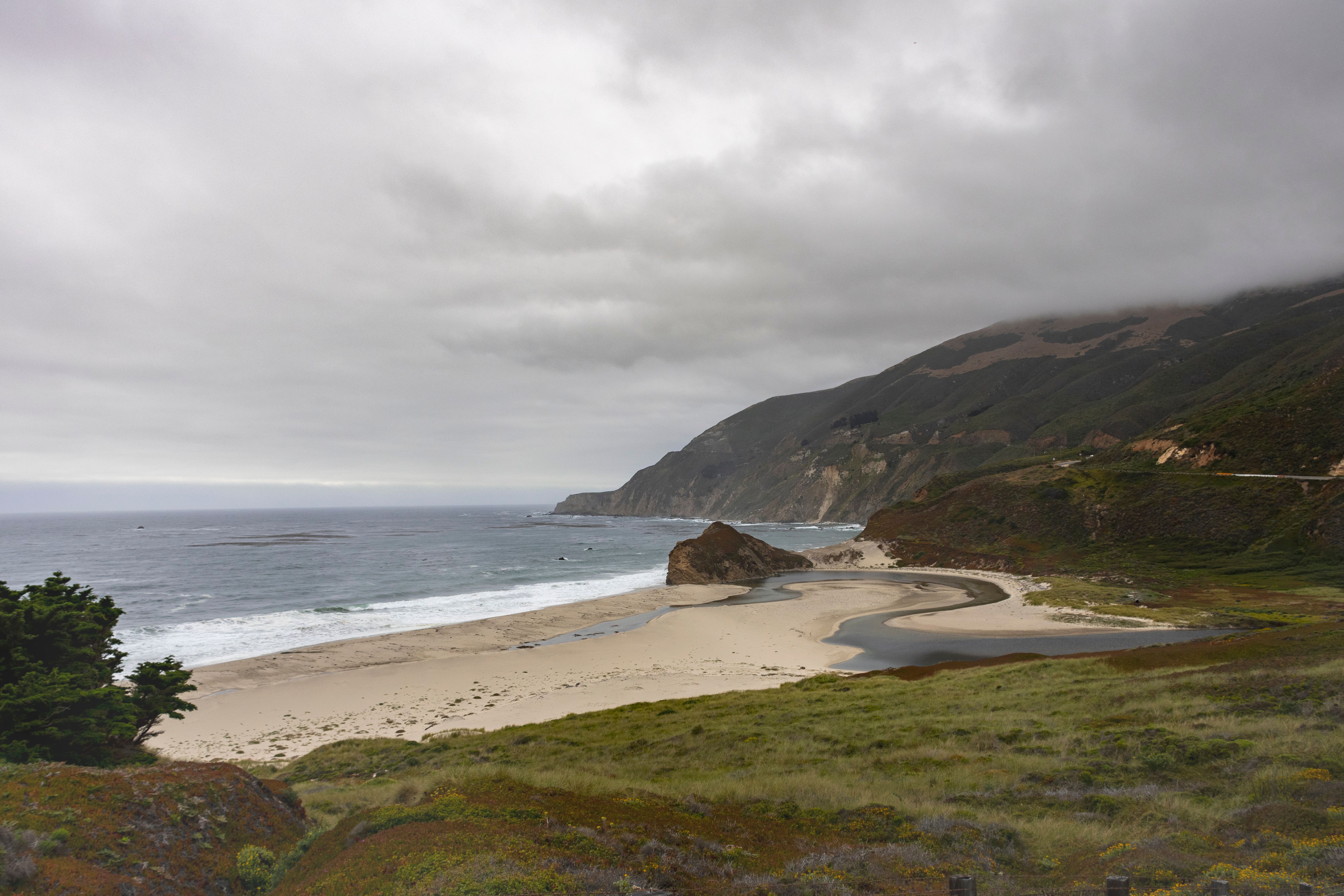 Scenic Coastal Landscape with Overcast Sky · Free Stock Photo