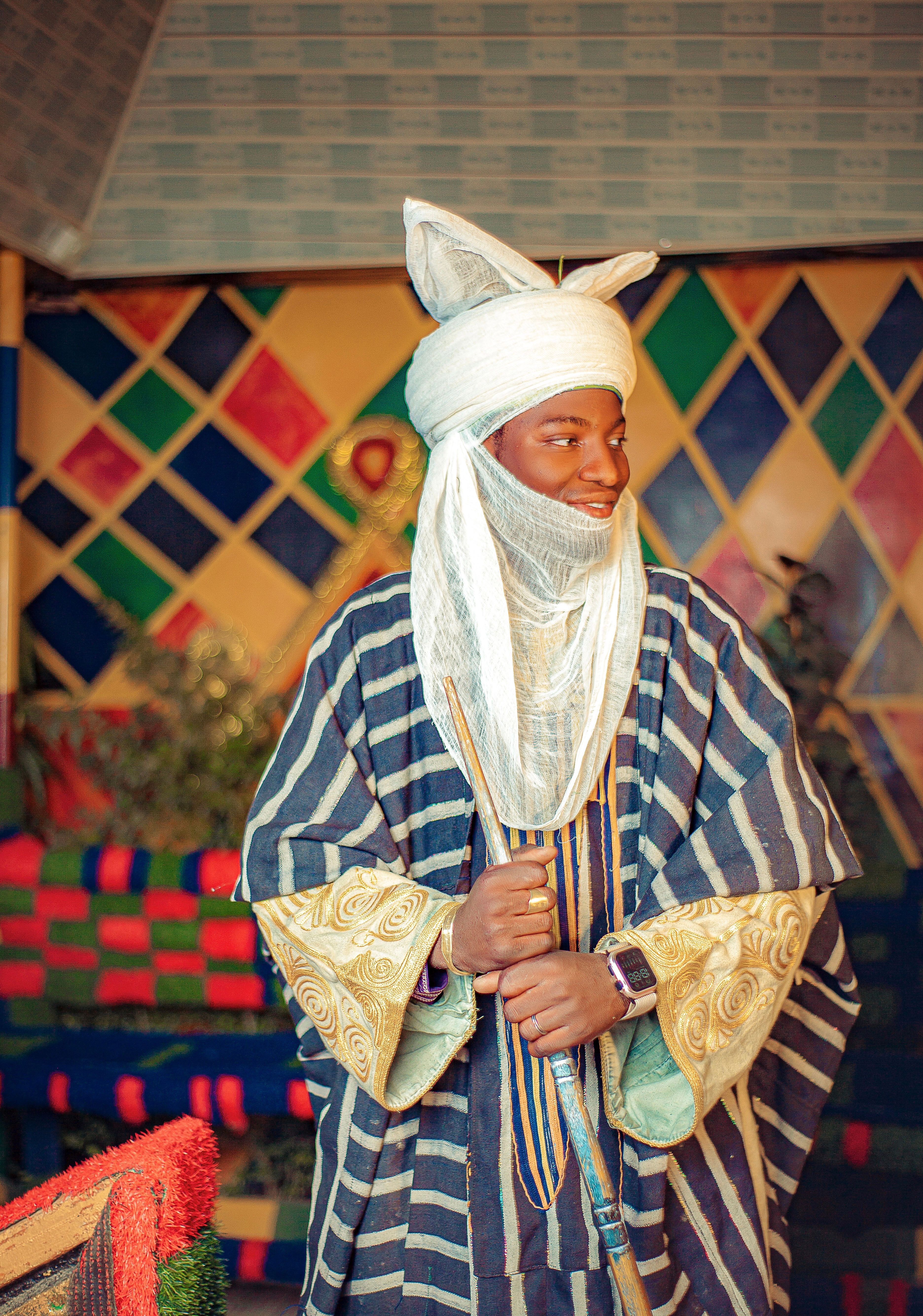 Priest in a Turban Holding a Cross · Free Stock Photo