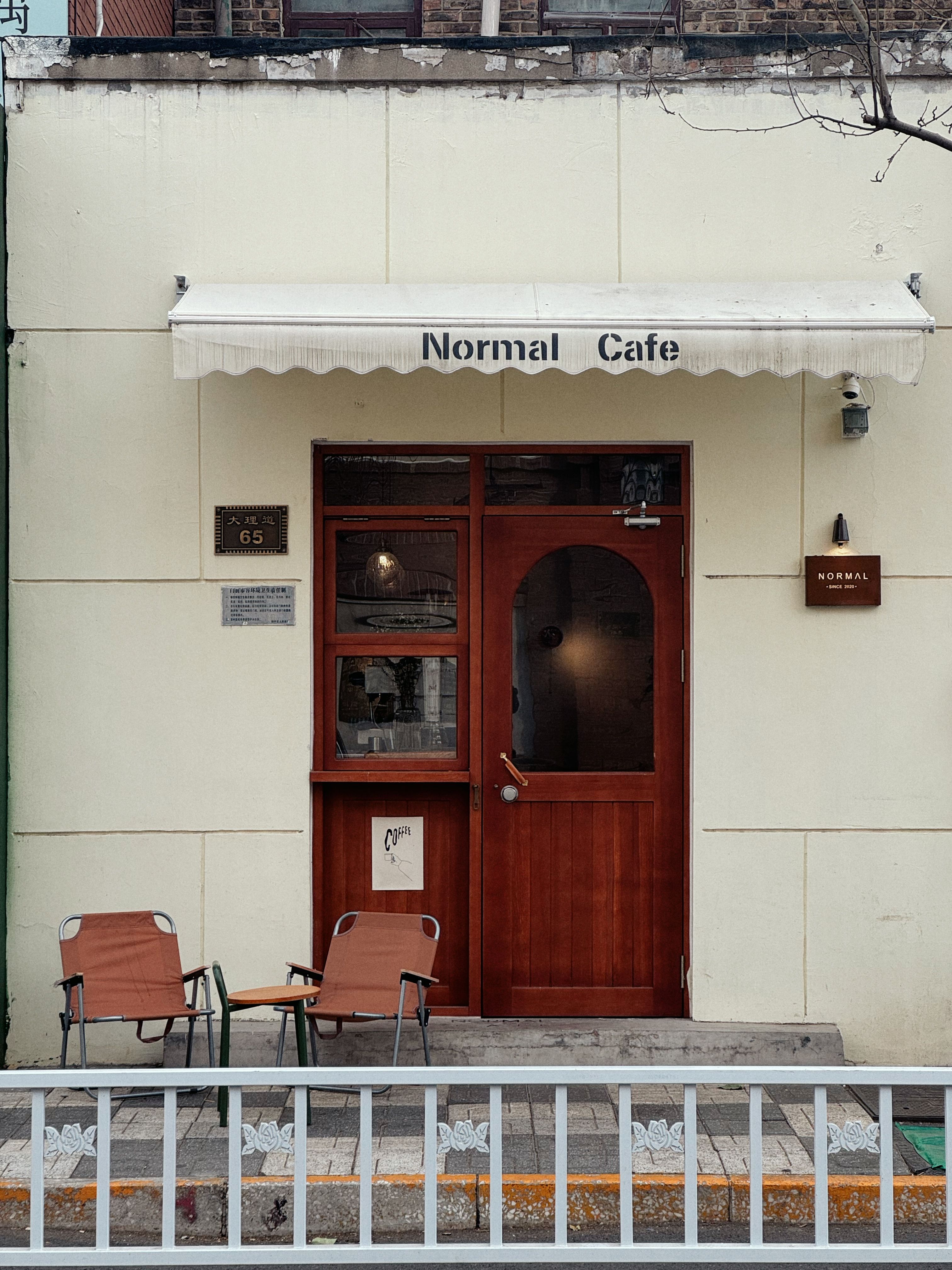 Charming Normal Cafe Facade in Urban Setting · Free Stock Photo