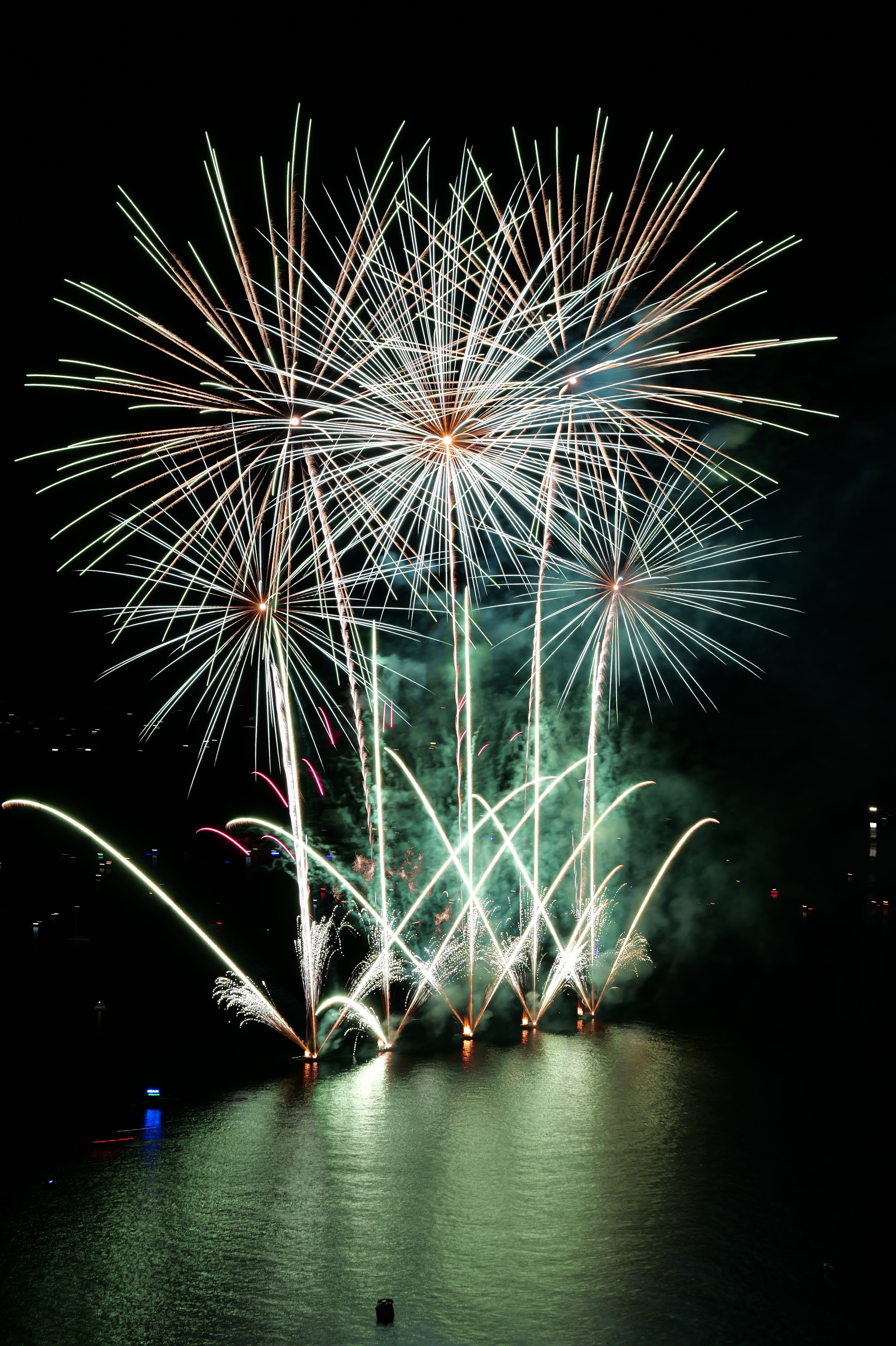 Spectacular Fireworks Display Over Water · Free Stock Photo