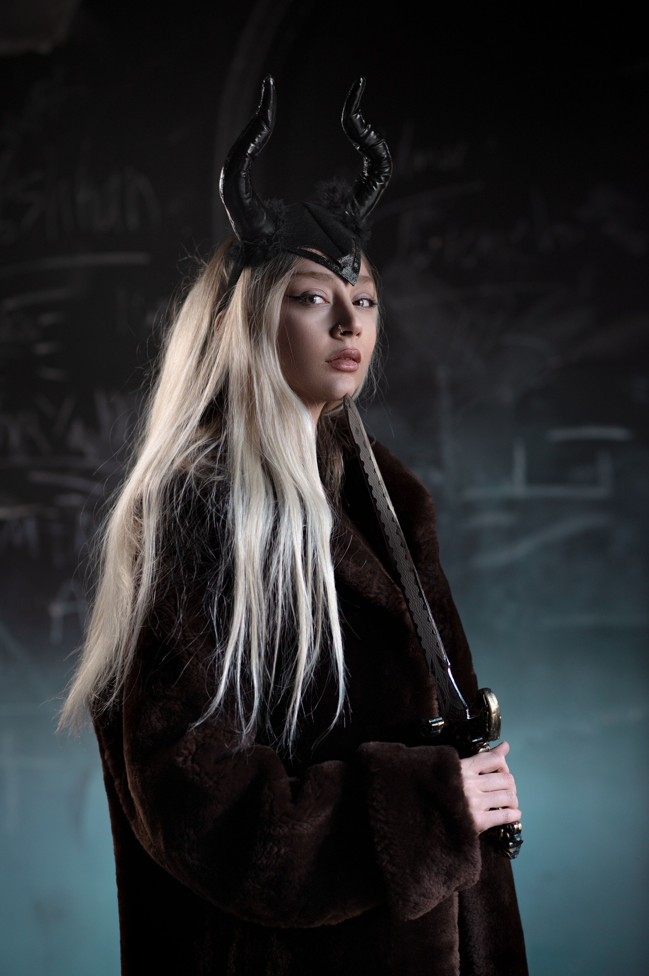 Mystical Woman with Horned Headdress and Sword · Free Stock Photo