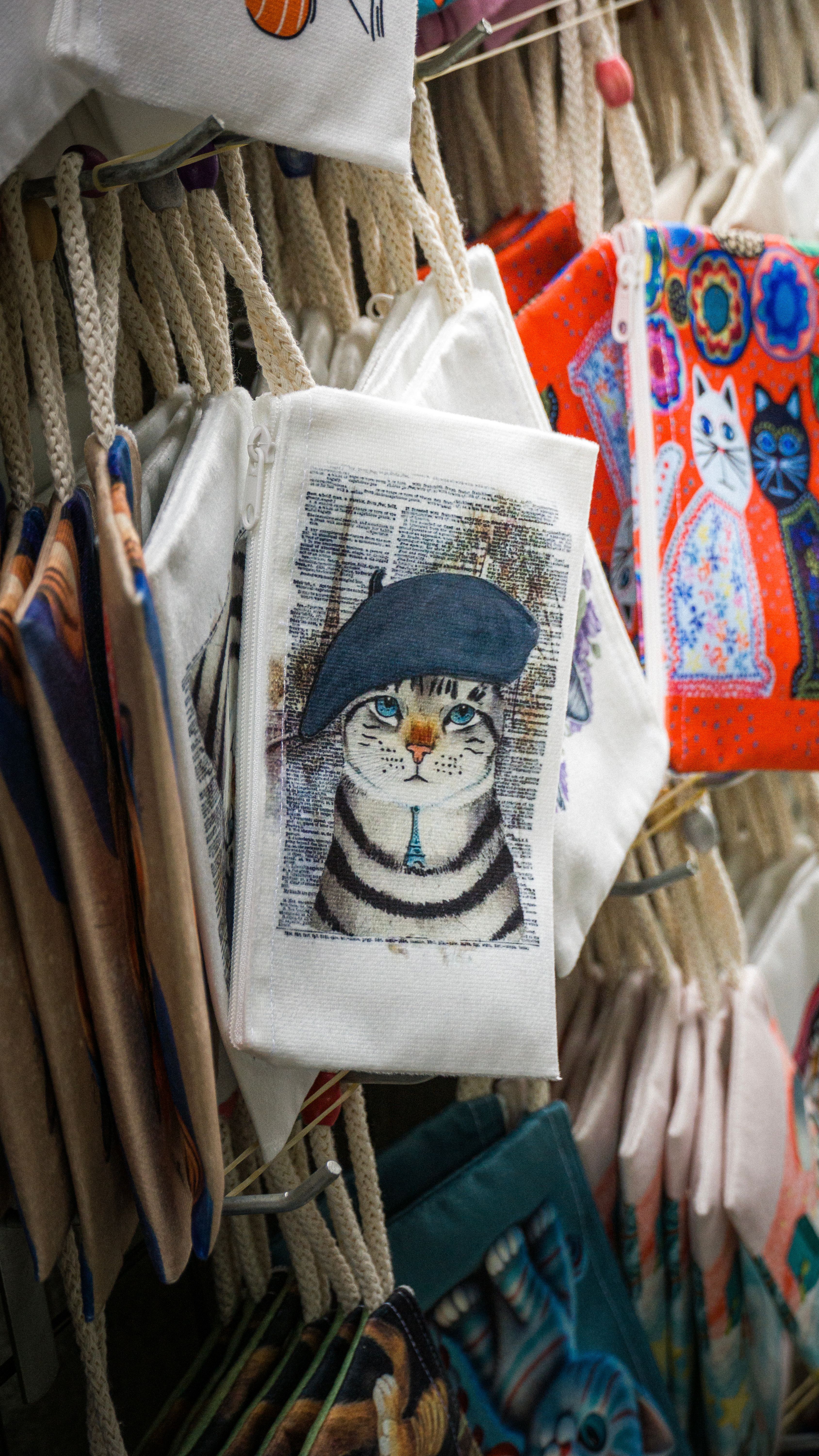 Colorful Cat-Themed Pouch Display Photography · Free Stock Photo