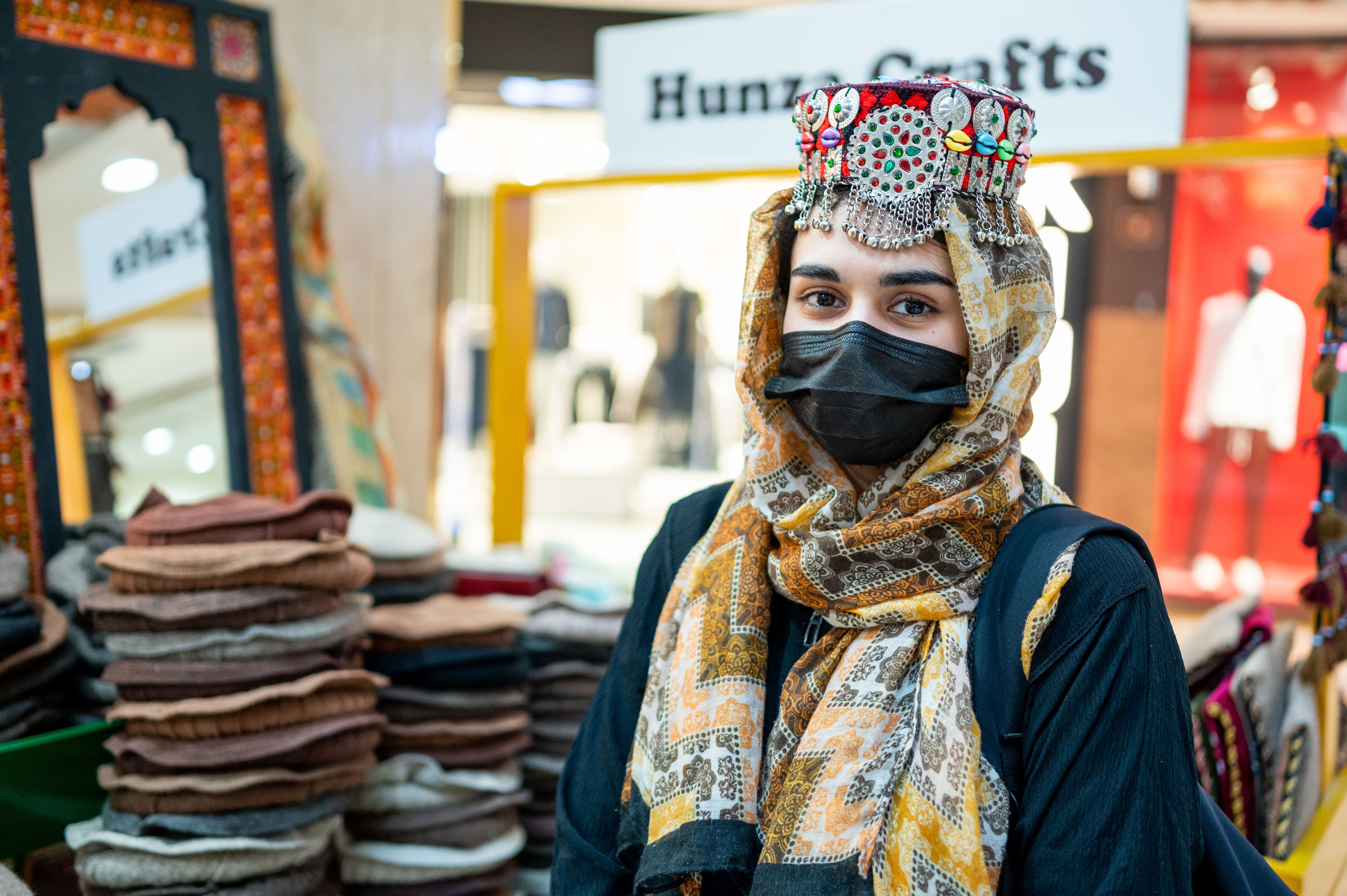 Woman in Traditional Headgear at Craft Market · Free Stock Photo
