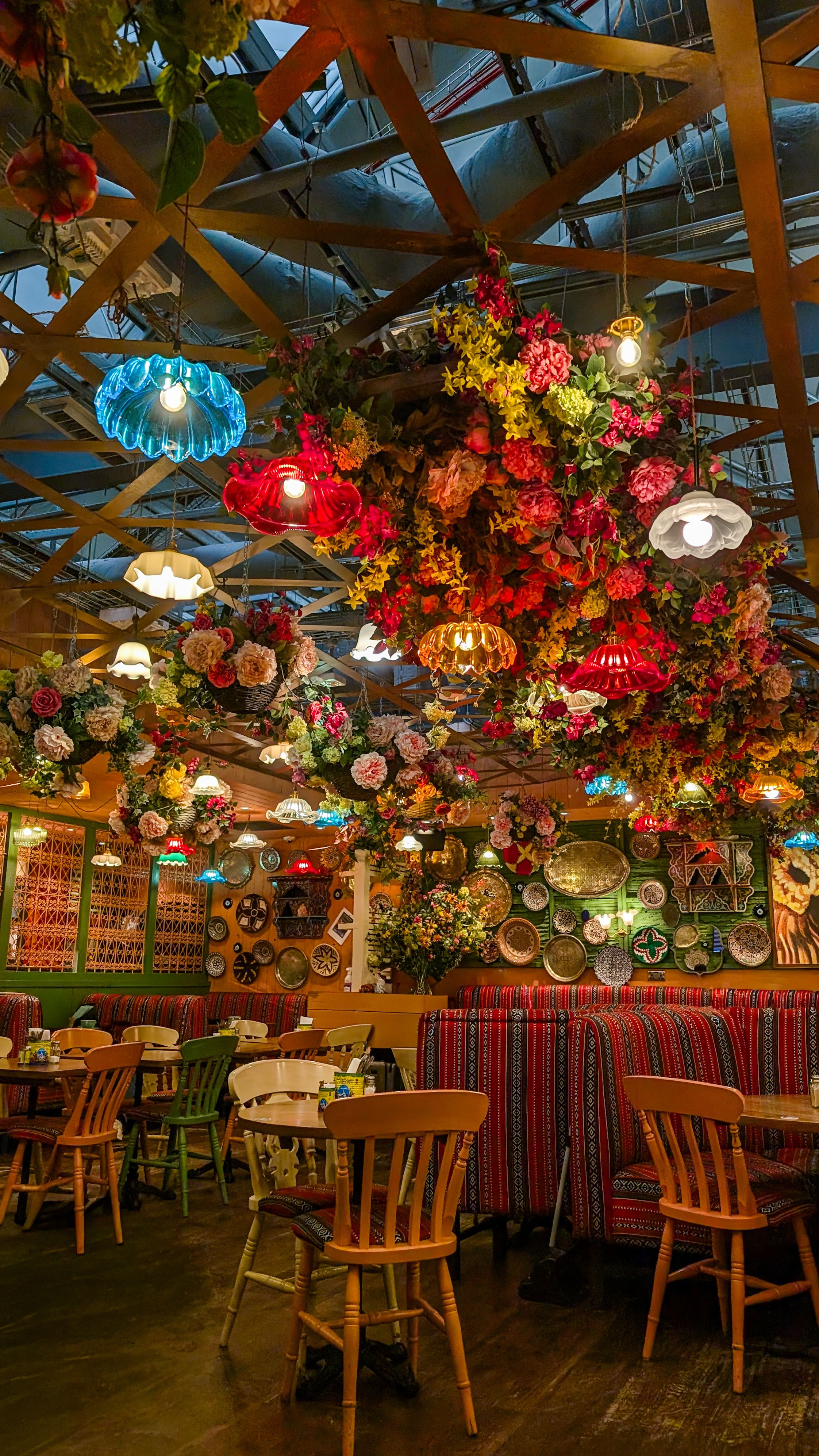 Vibrant Restaurant Interior with Floral Decor · Free Stock Photo
