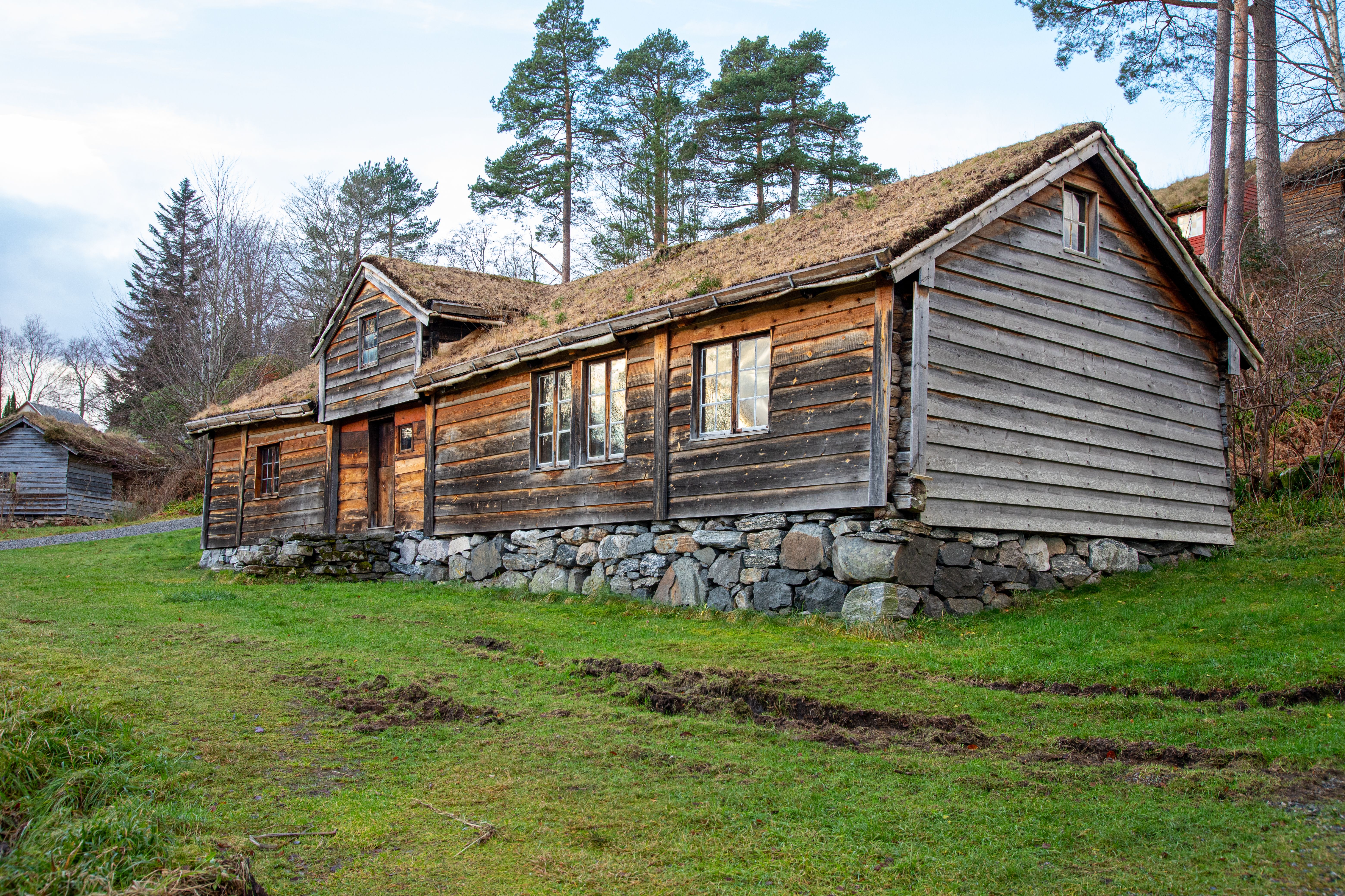 Traditional Norwegian Log Cabin in Scenic Landscape · Free Stock Photo