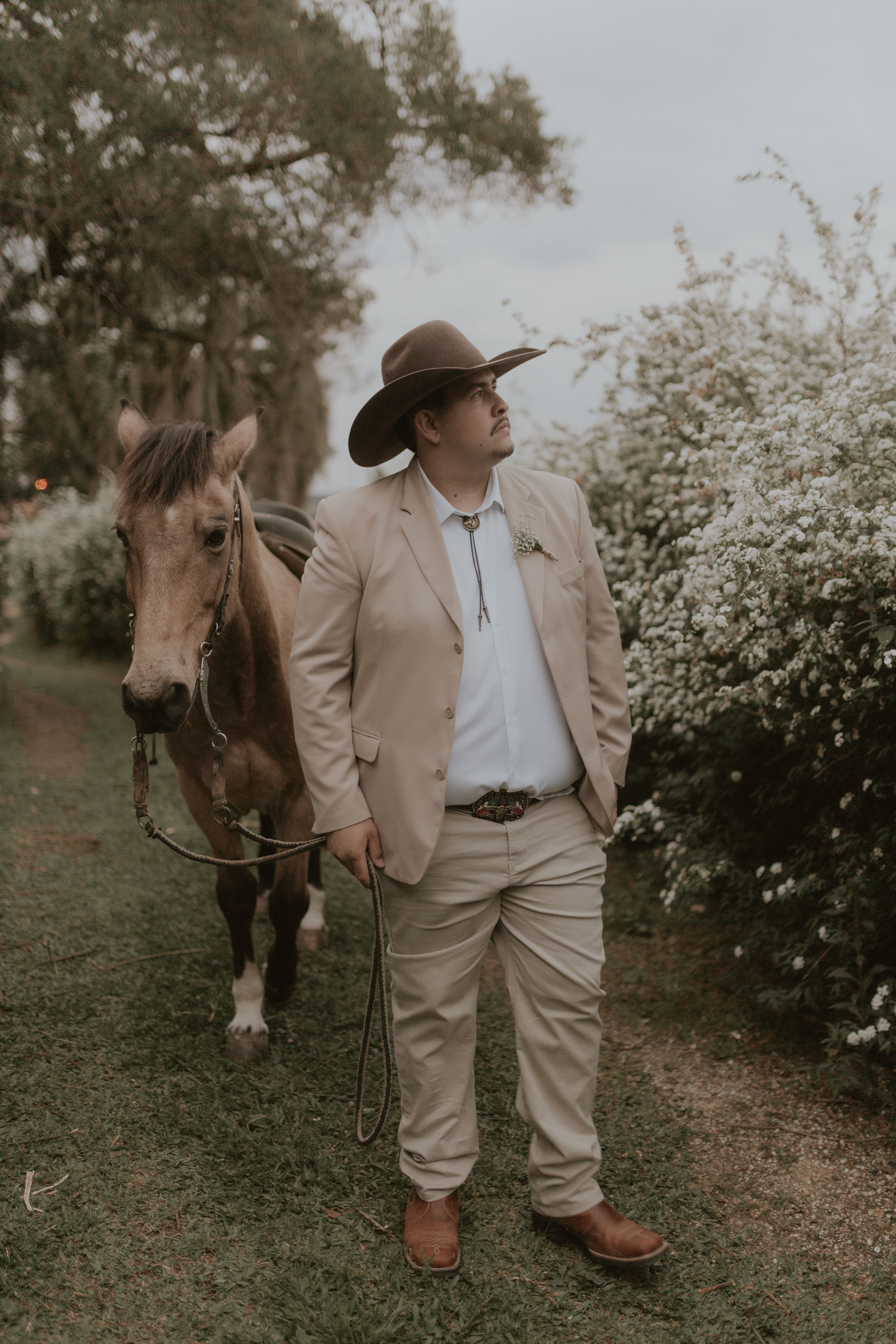 Rustic Cowboy with Horse in Blooming Garden · Free Stock Photo