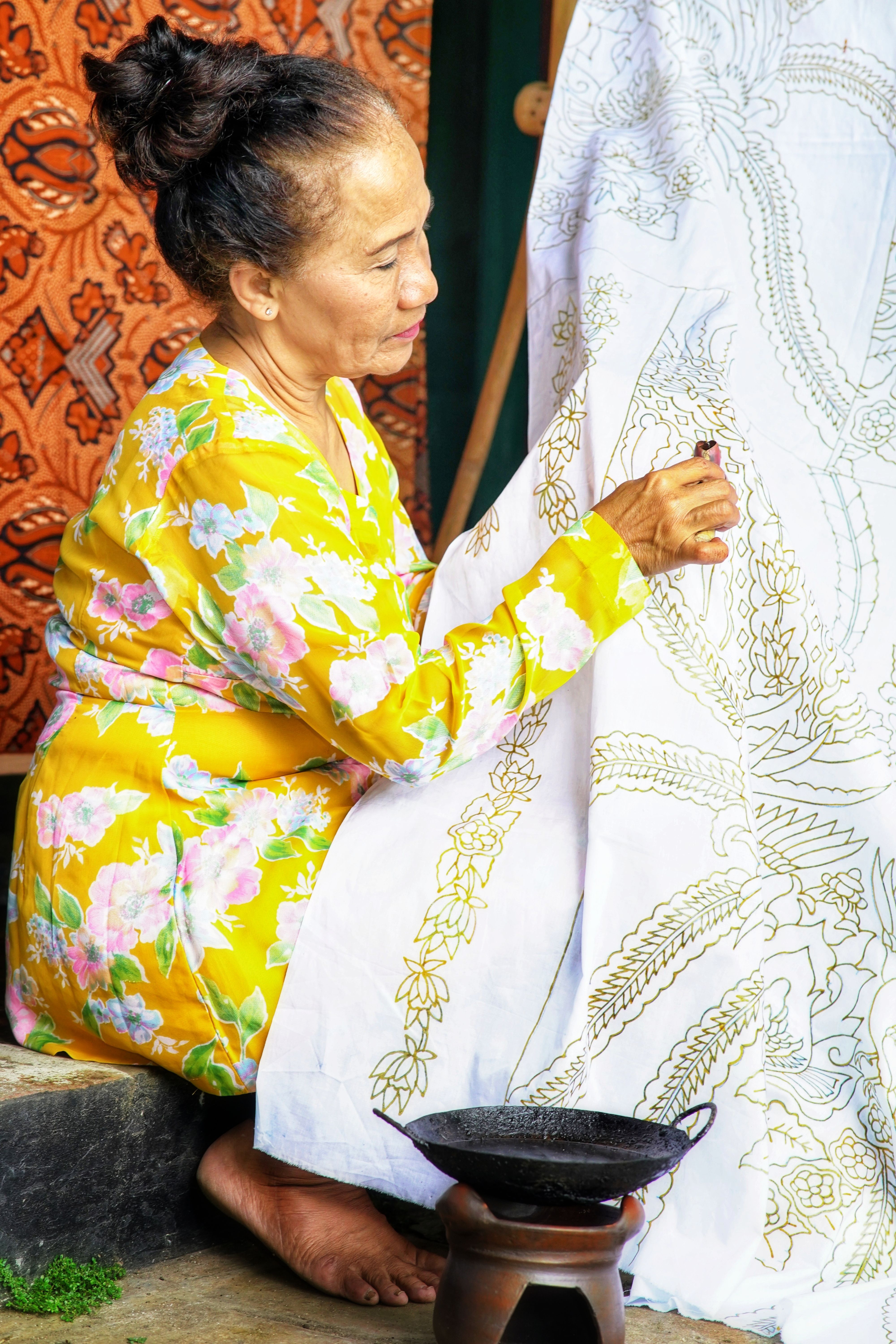 Artisan Crafting Intricate Batik Design in Indonesia · Free Stock Photo