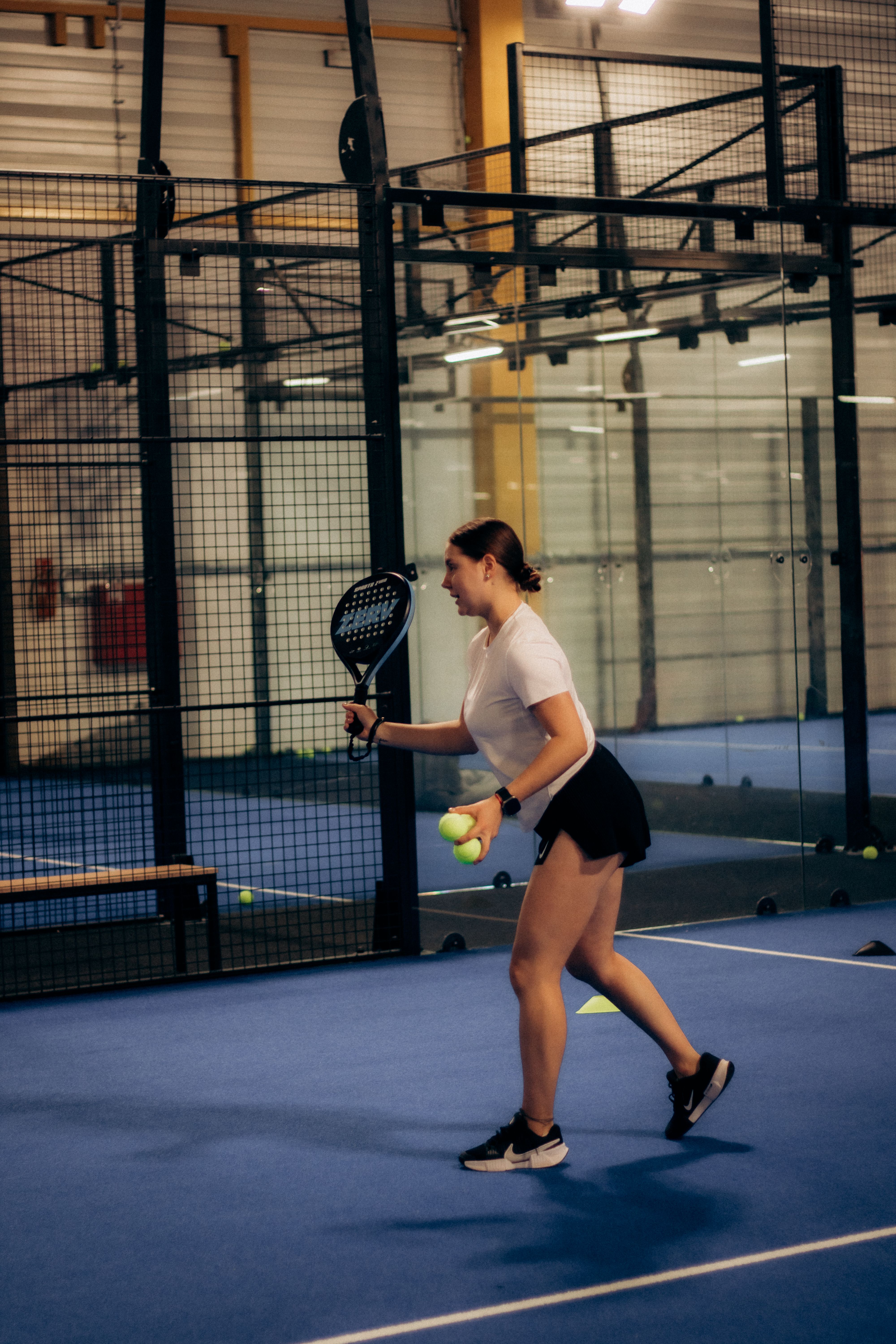 Indoor Tennis Training Session in Black and White · Free Stock Photo