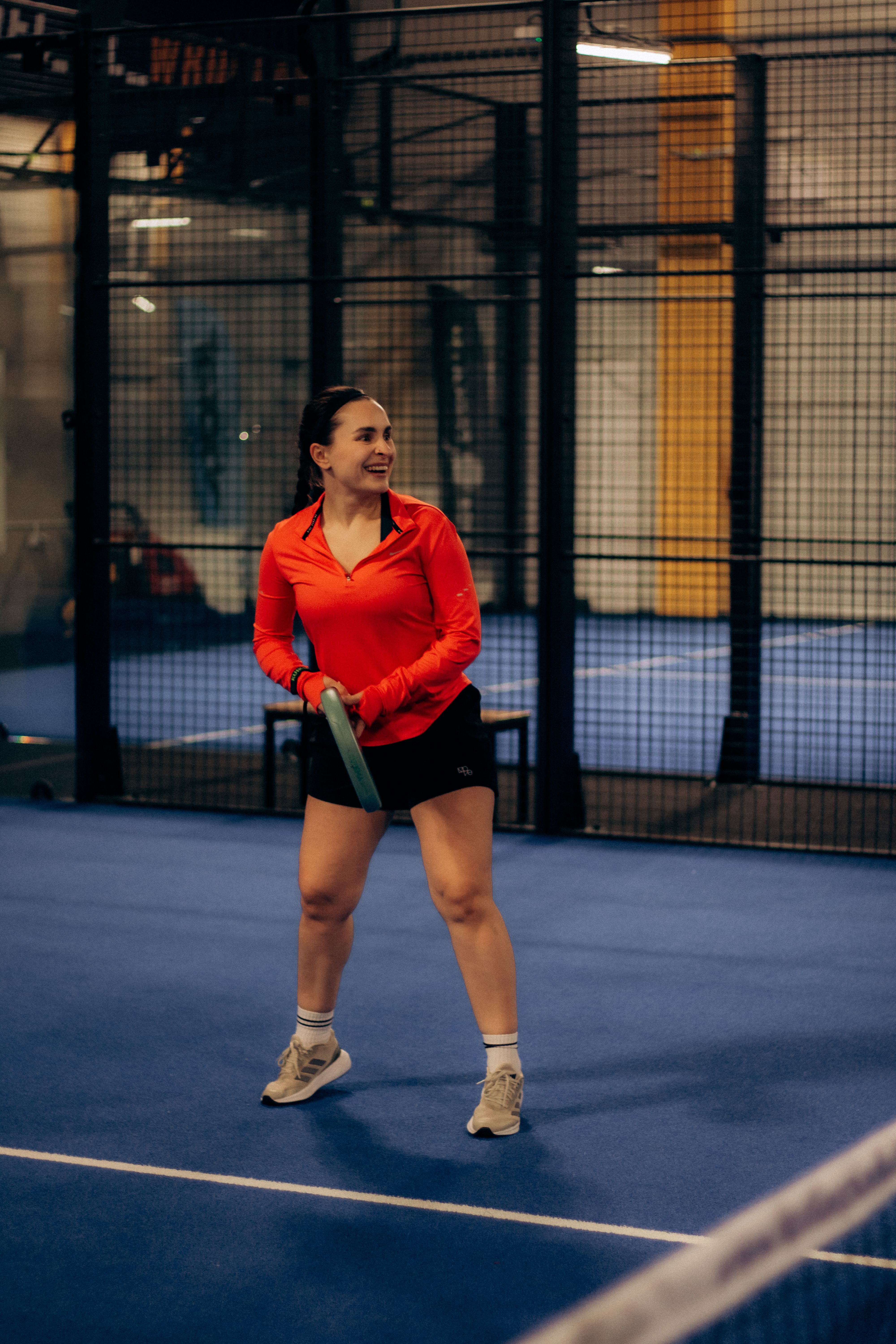 Woman Playing Paddle Tennis on Indoor Court · Free Stock Photo