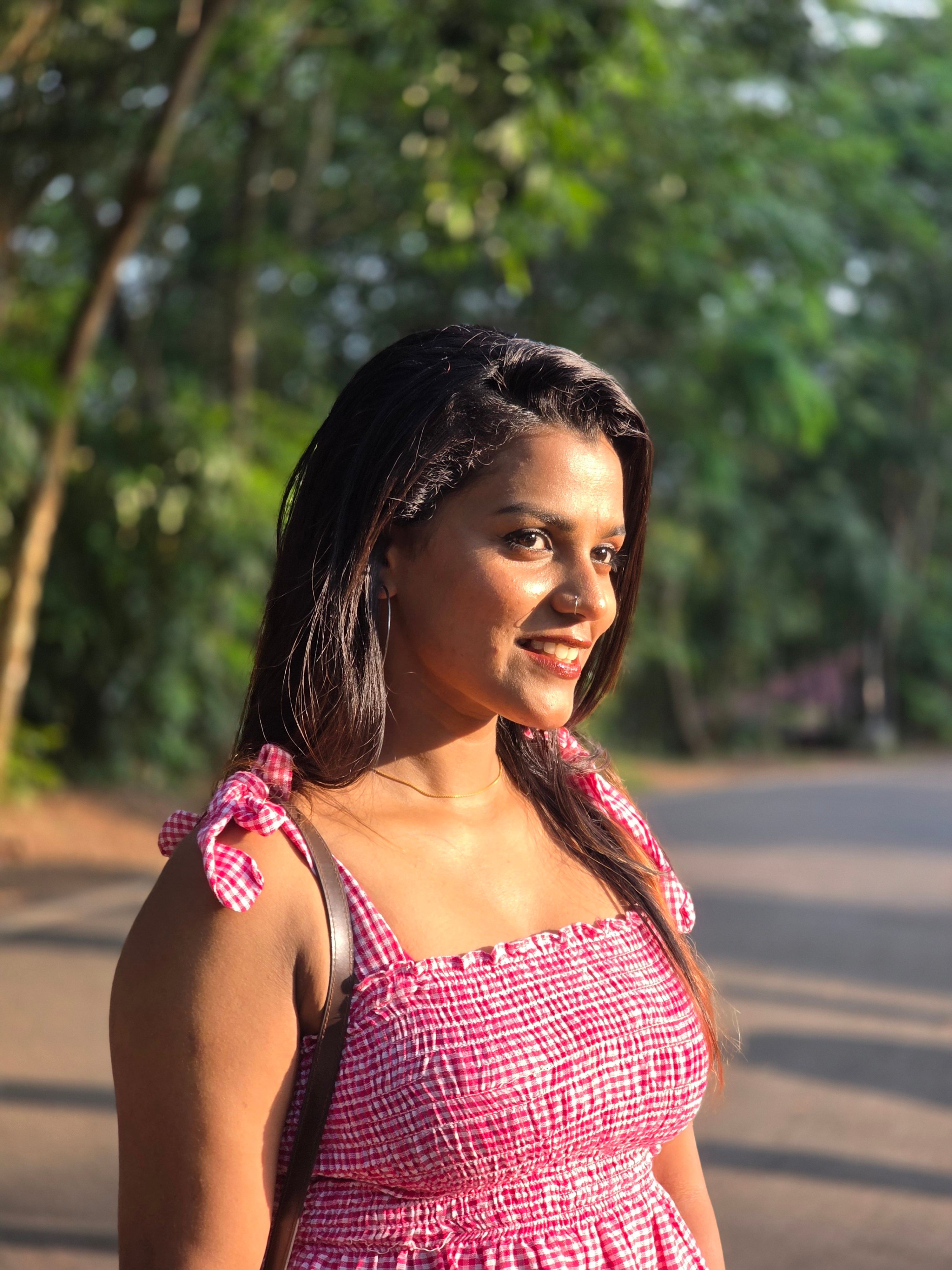 Portrait of a Woman in Pink Sundress Outdoors · Free Stock Photo