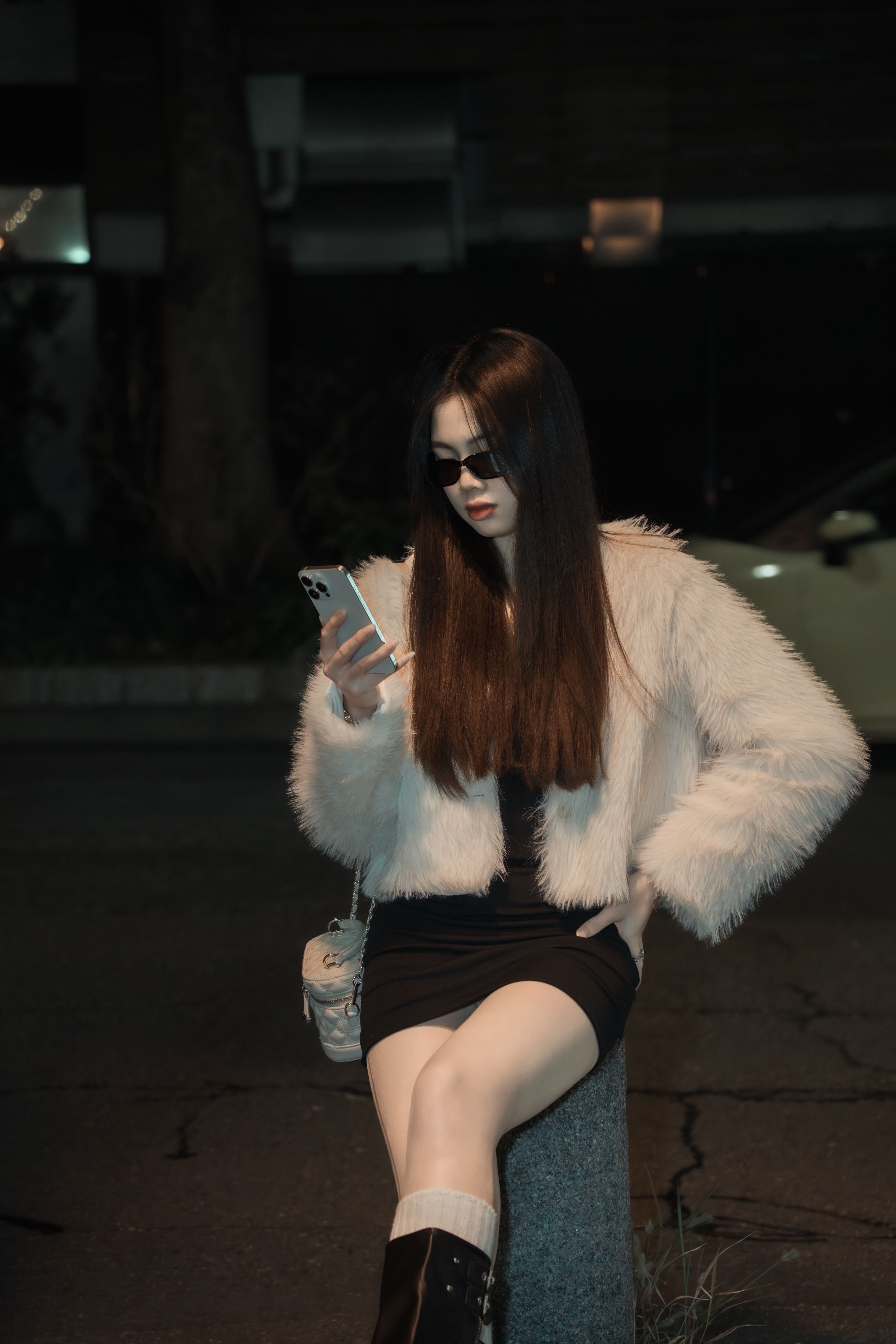 Chic Woman Using Smartphone at Night · Free Stock Photo