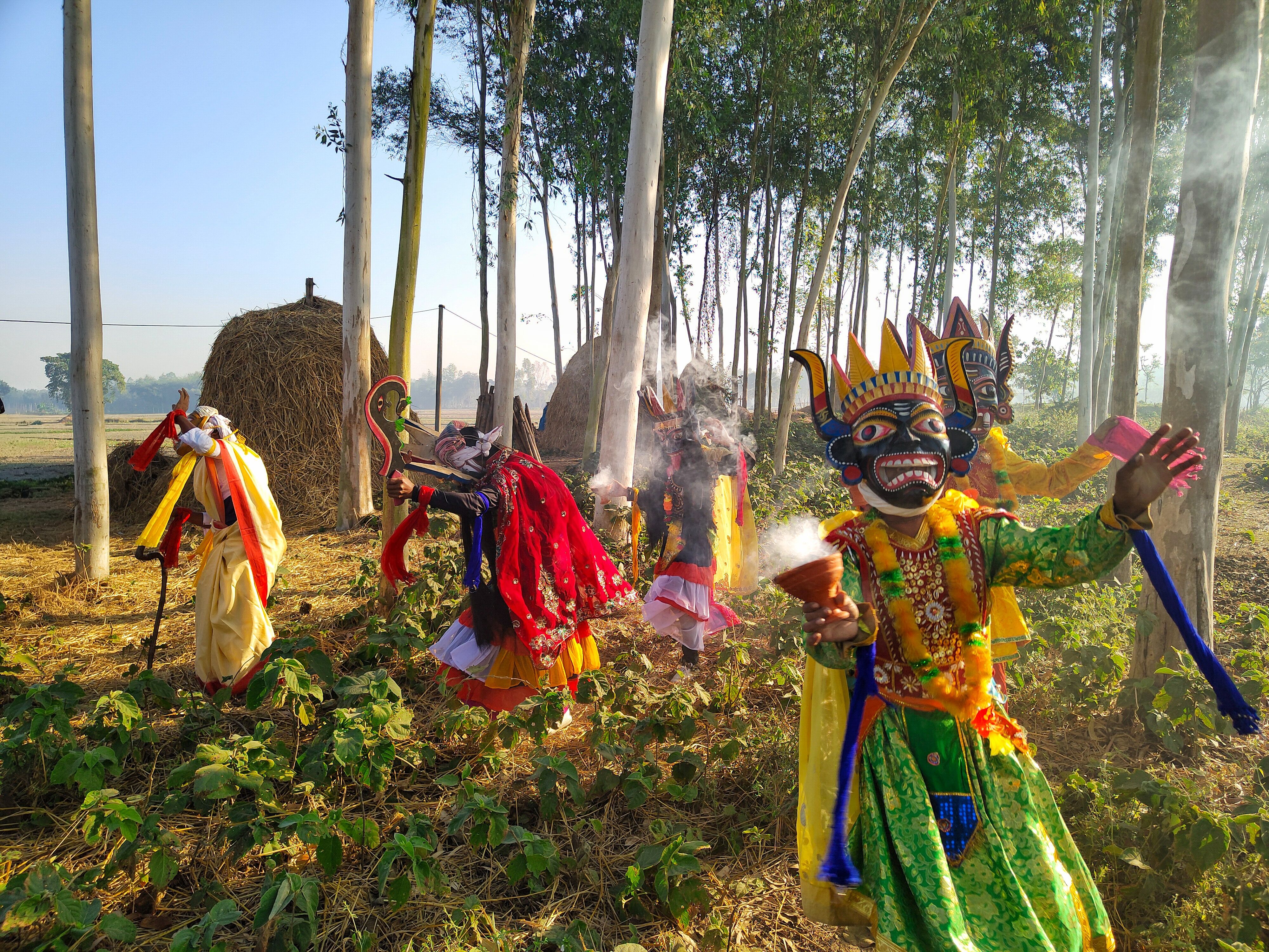 Vibrant Traditional Dance in Forest Setting · Free Stock Photo