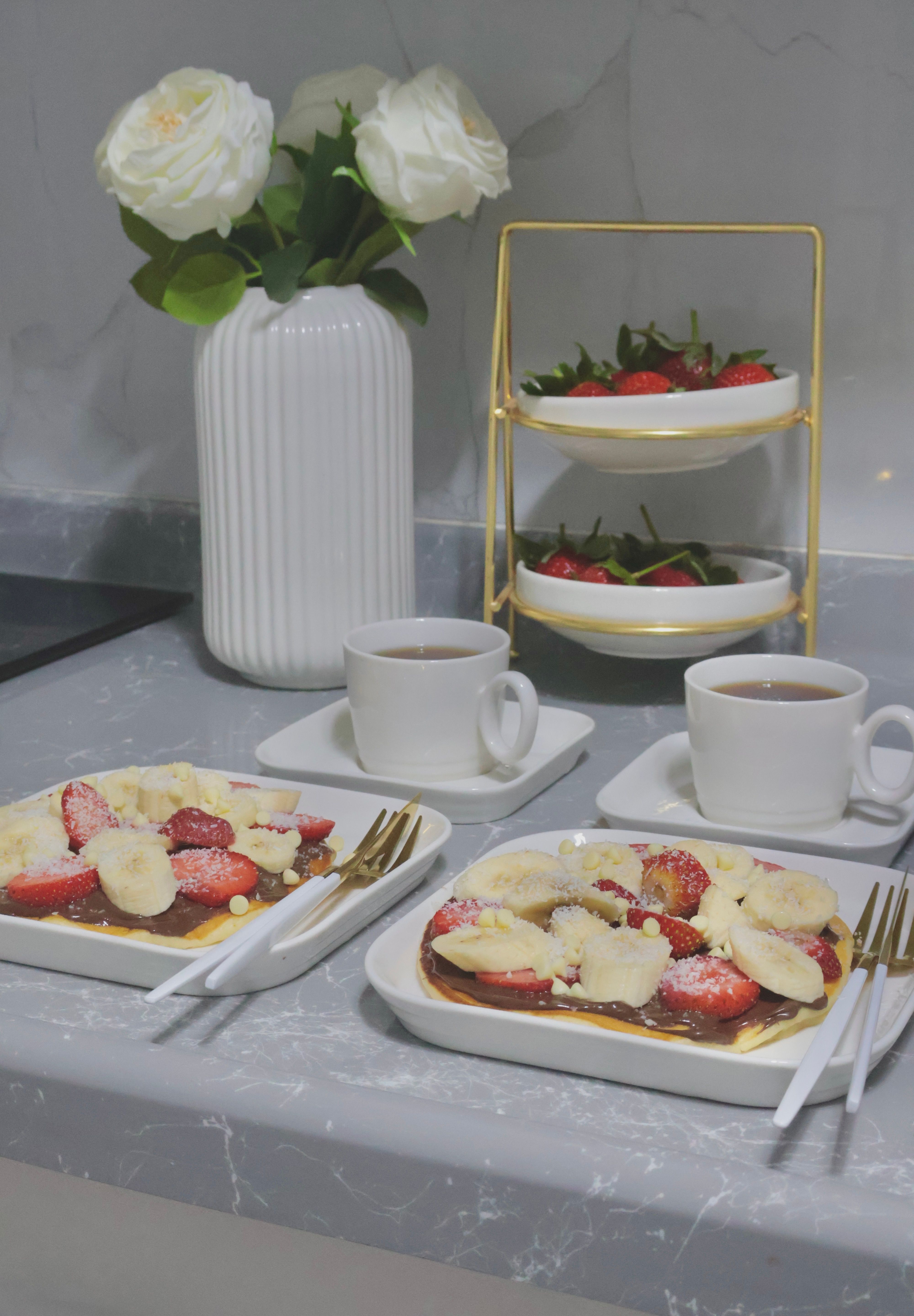 Elegant Breakfast Setting with Fruits and Flowers · Free Stock Photo