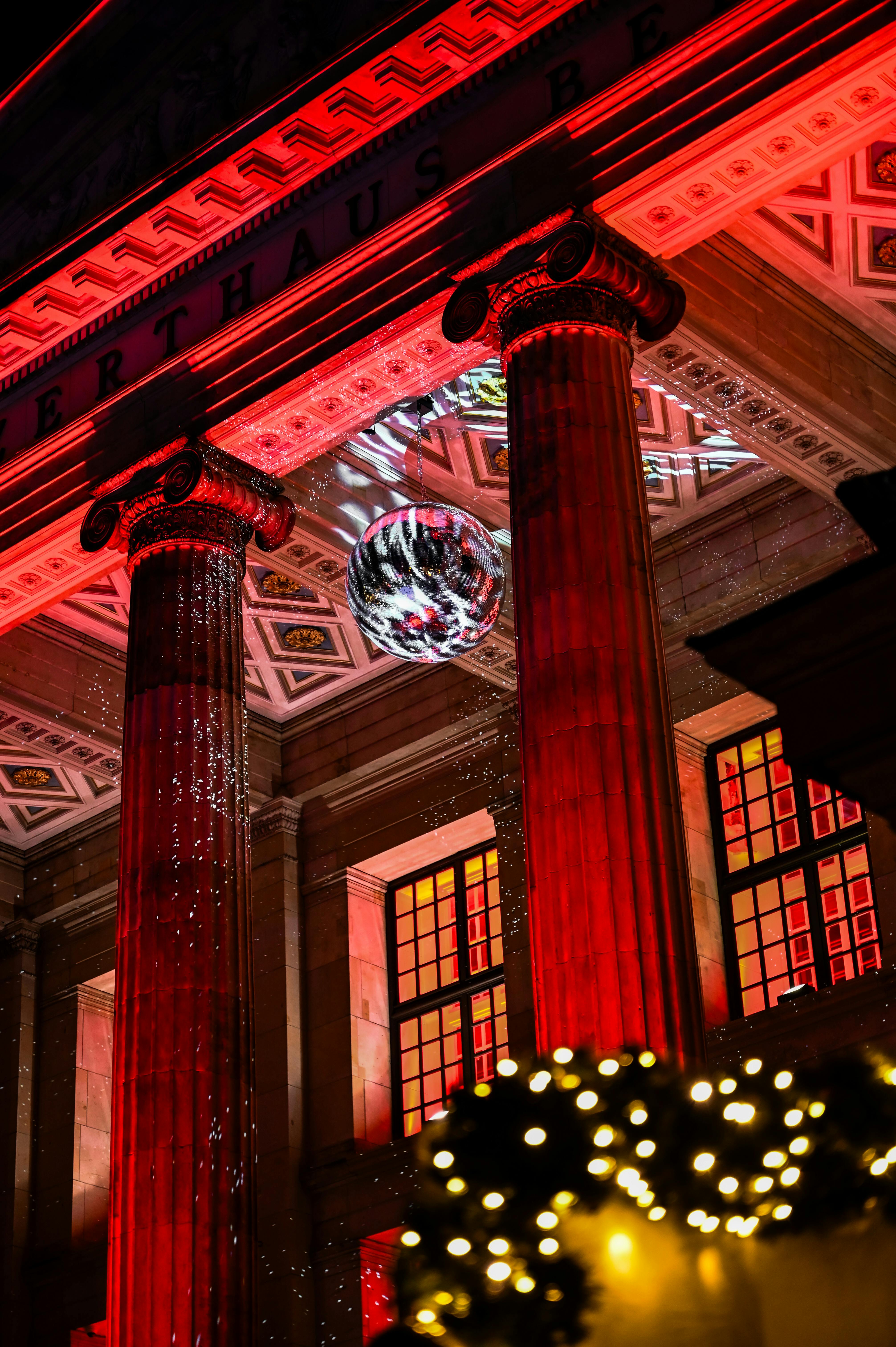 Festive Illuminated Building with Disco Ball · Free Stock Photo