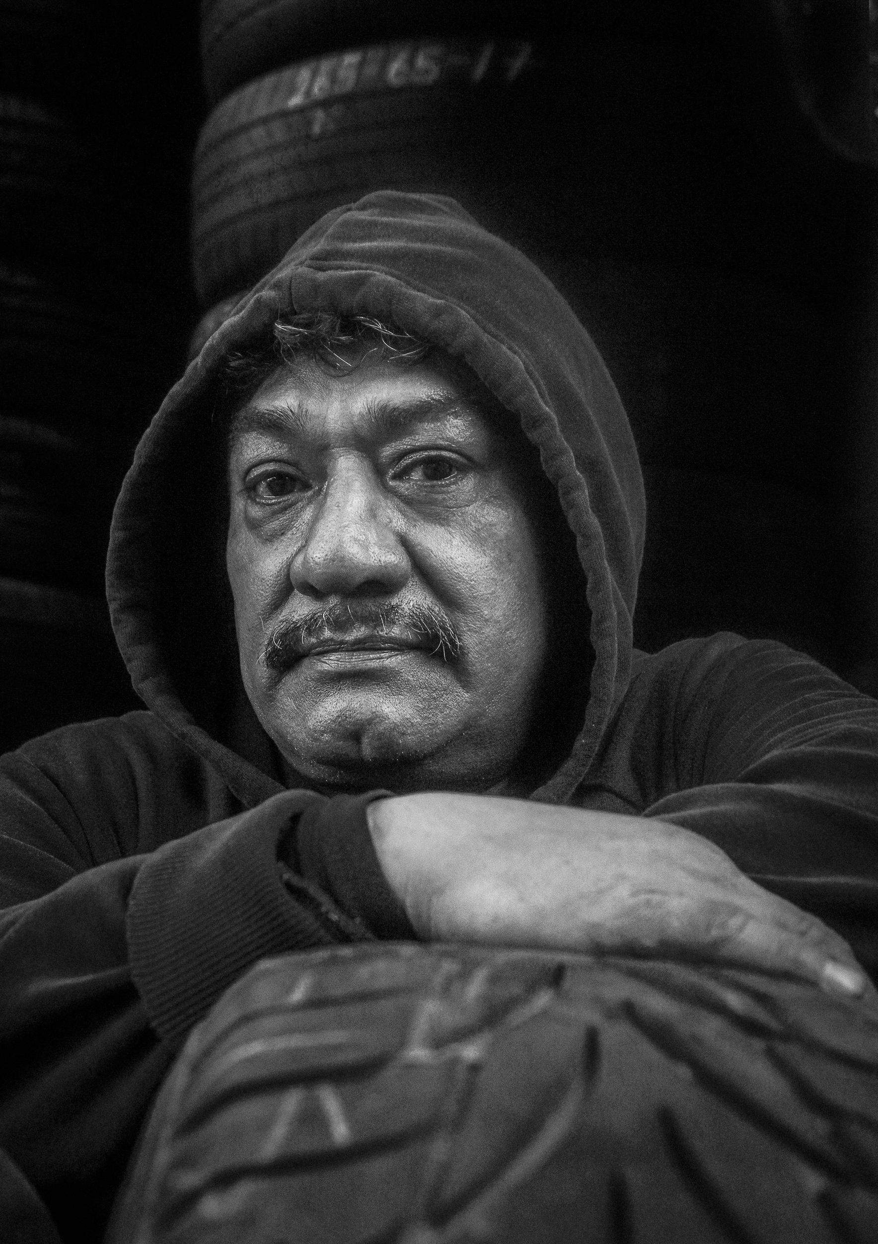 Black and White Portrait of Man with Tire · Free Stock Photo