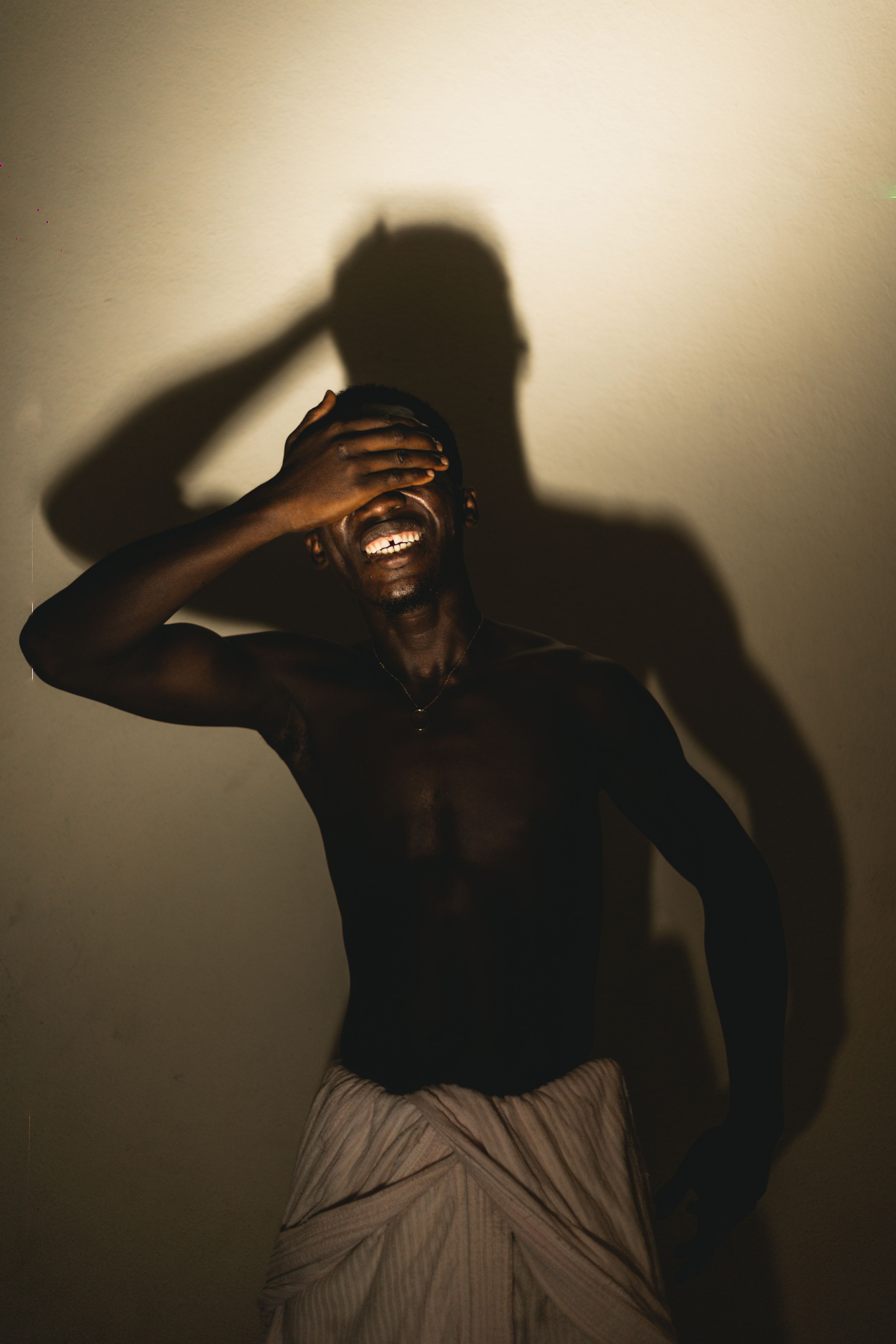 Dark Portrait with Dramatic Shadow Play · Free Stock Photo