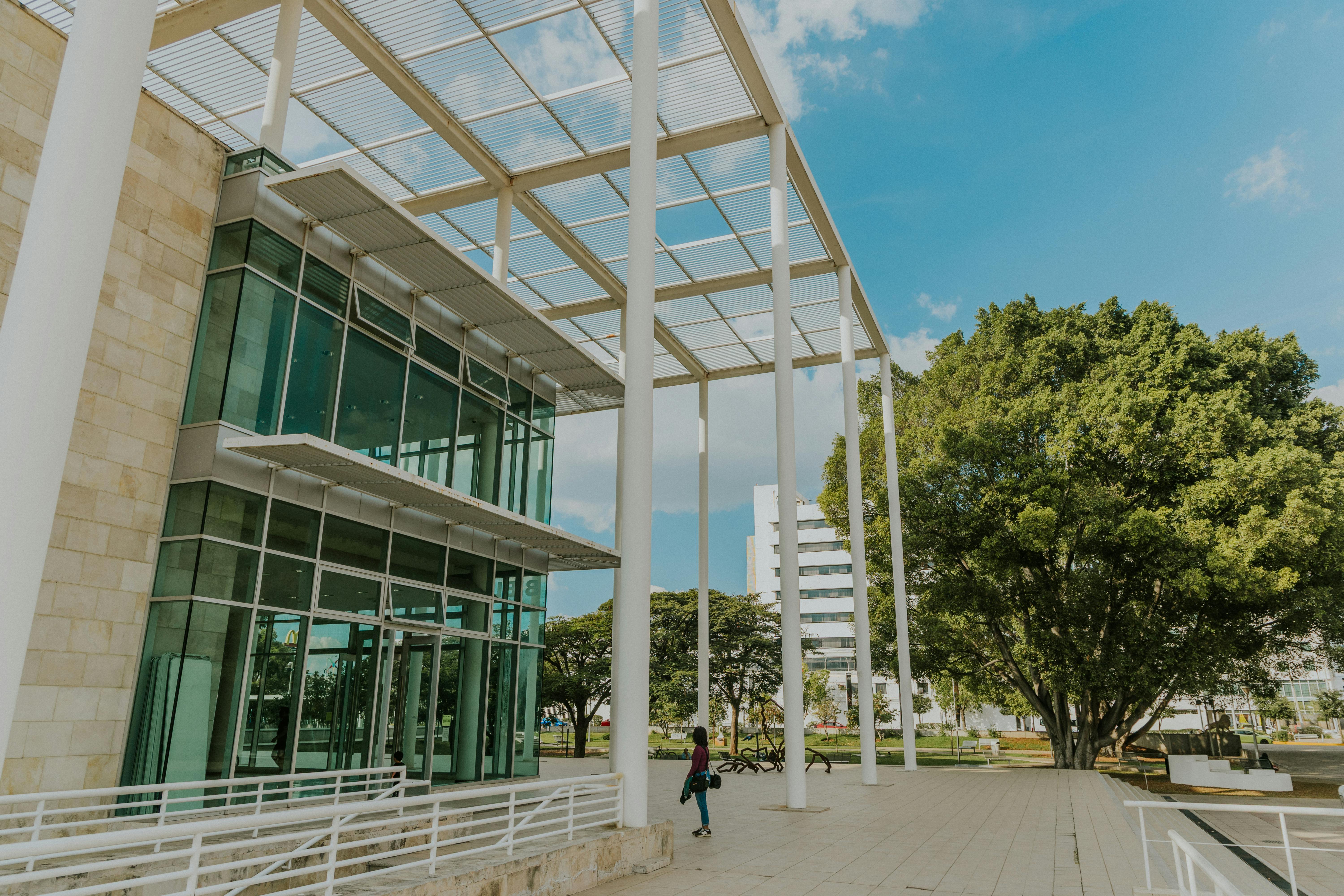 Modern Glass Building with Outdoor Column Structure · Free Stock Photo