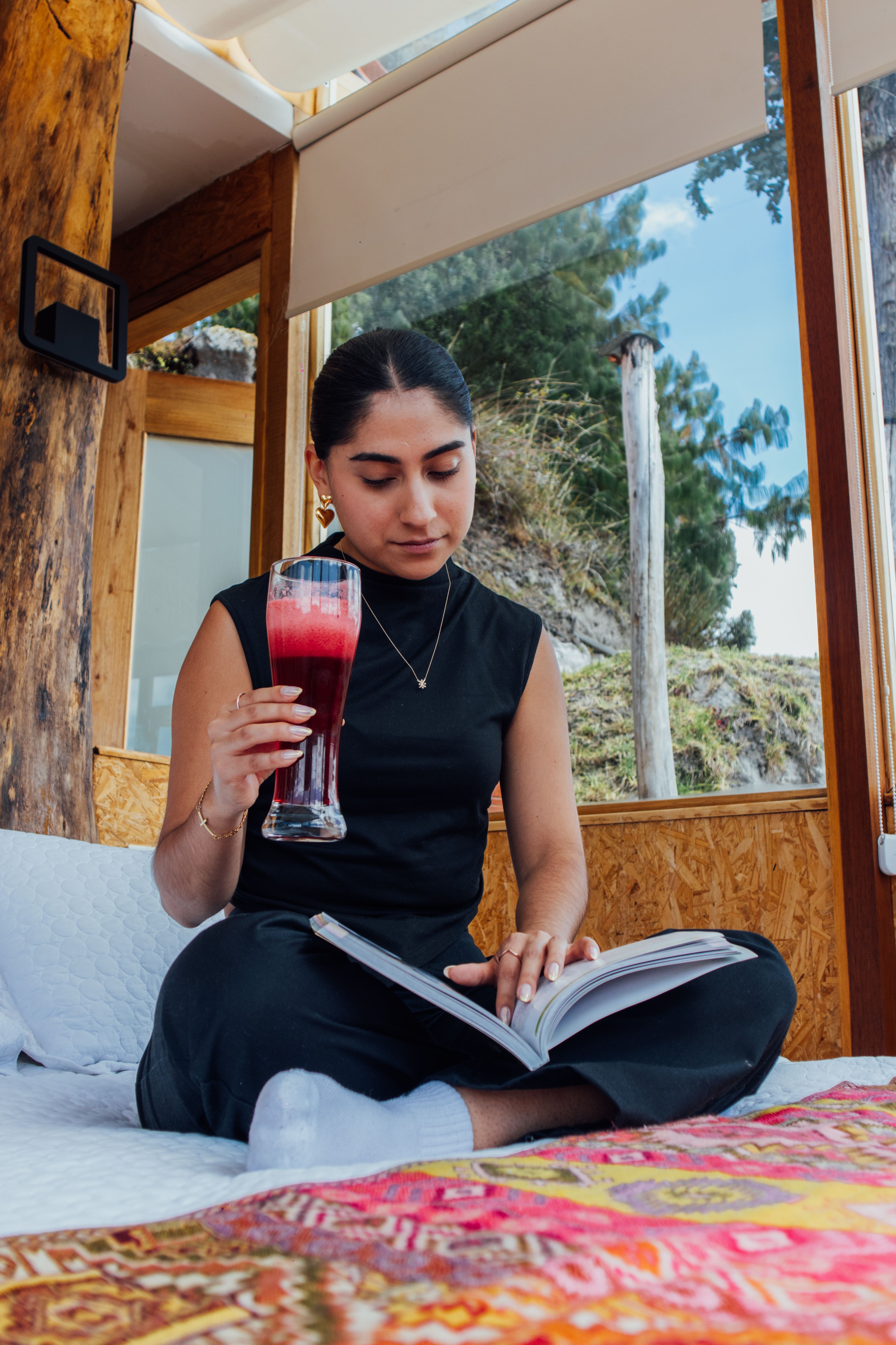 Woman Reading with a Refreshing Drink by Window · Free Stock Photo