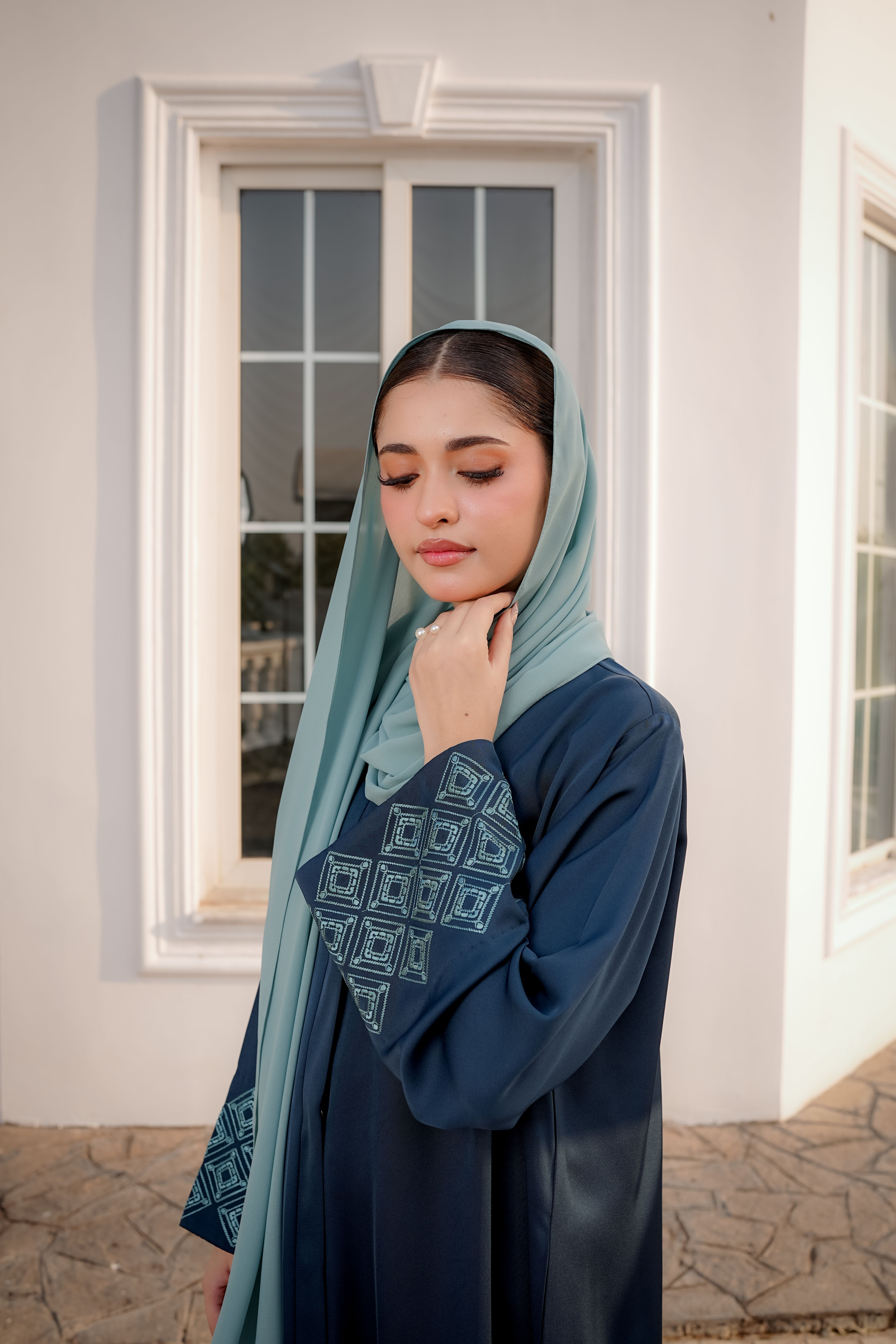 Elegant Woman in Modest Fashion by Window · Free Stock Photo