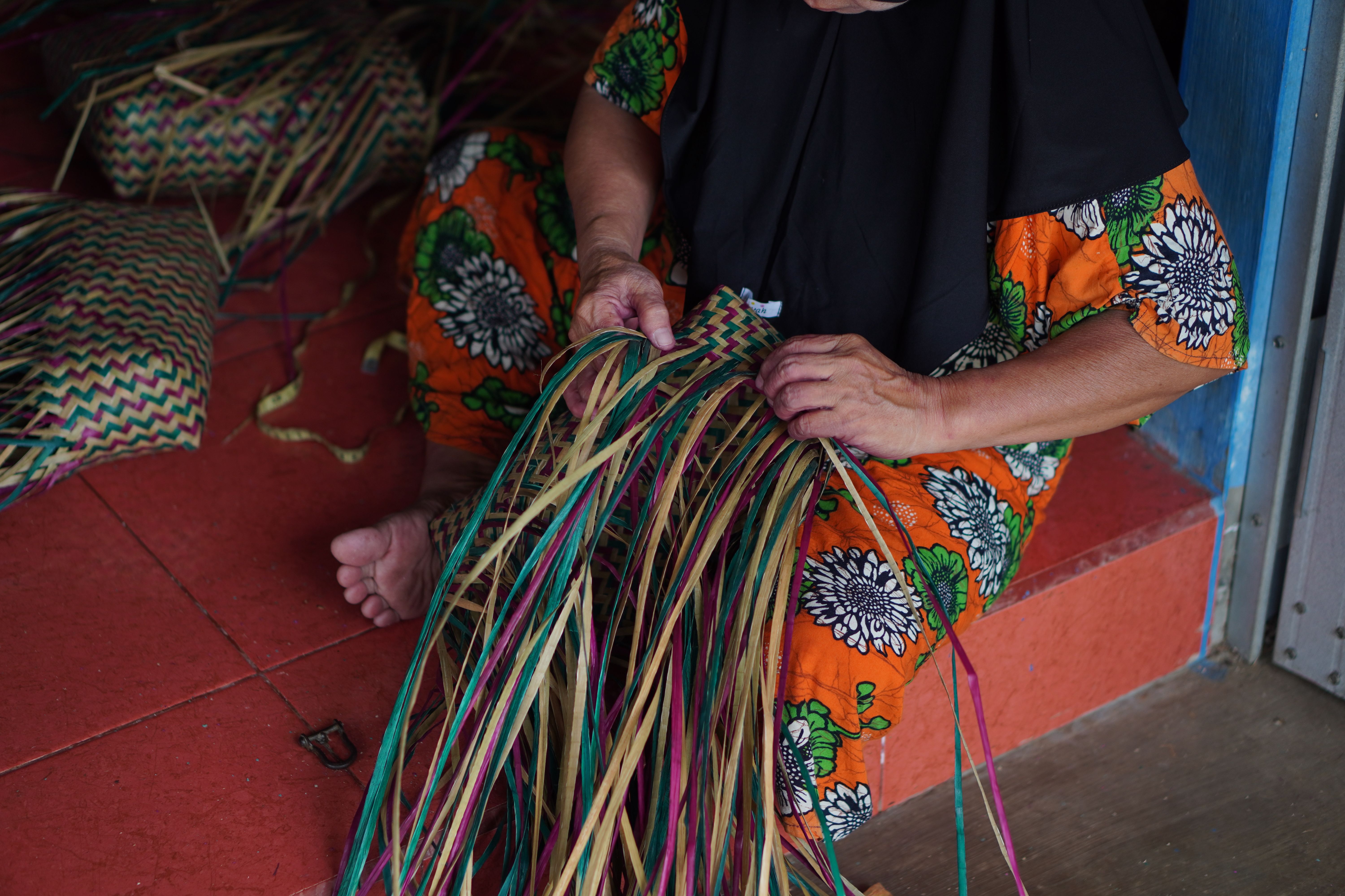 Indonesian Woman Weaving Colorful Baskets · Free Stock Photo