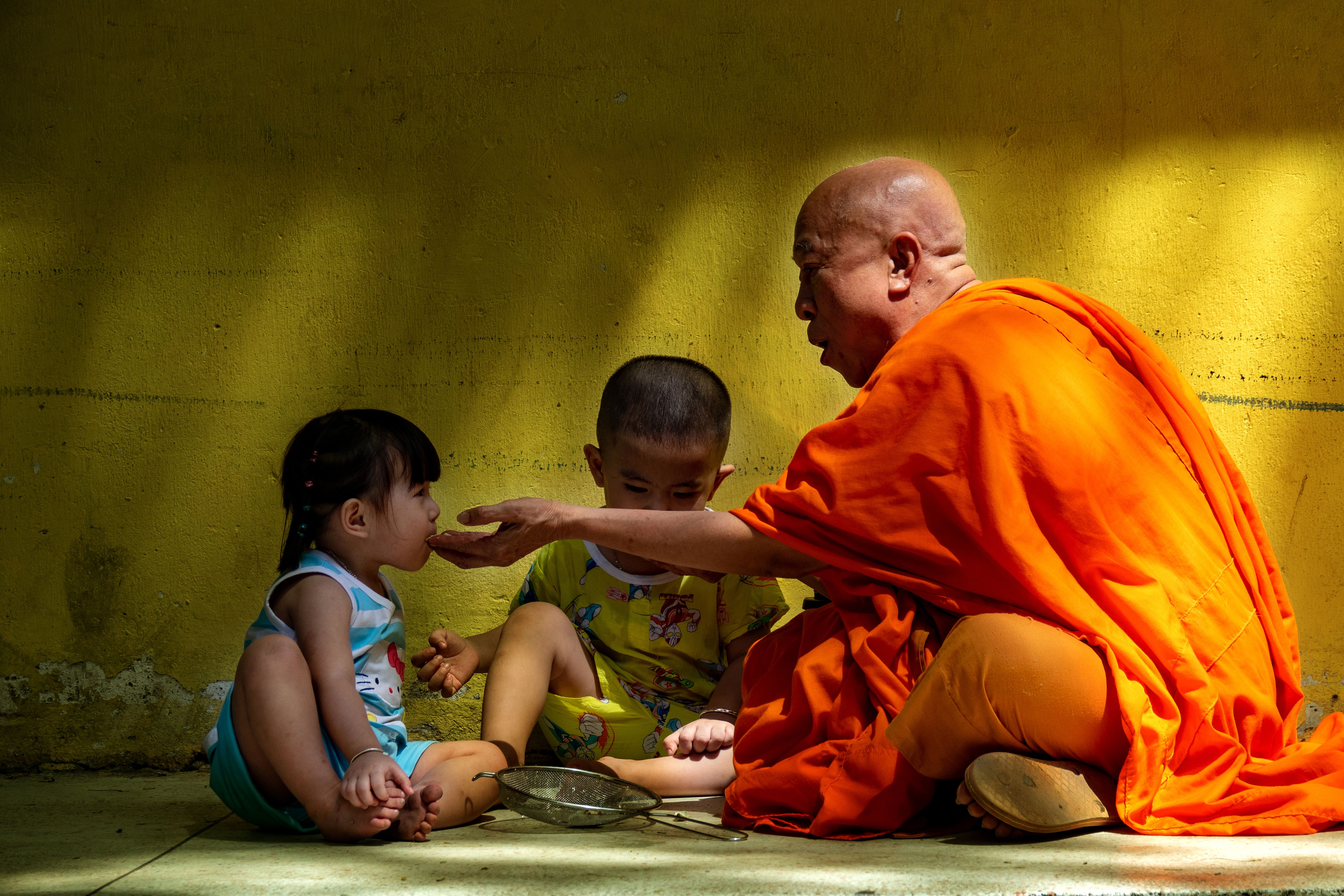 Buddhist Monk Interacting with Children · Free Stock Photo
