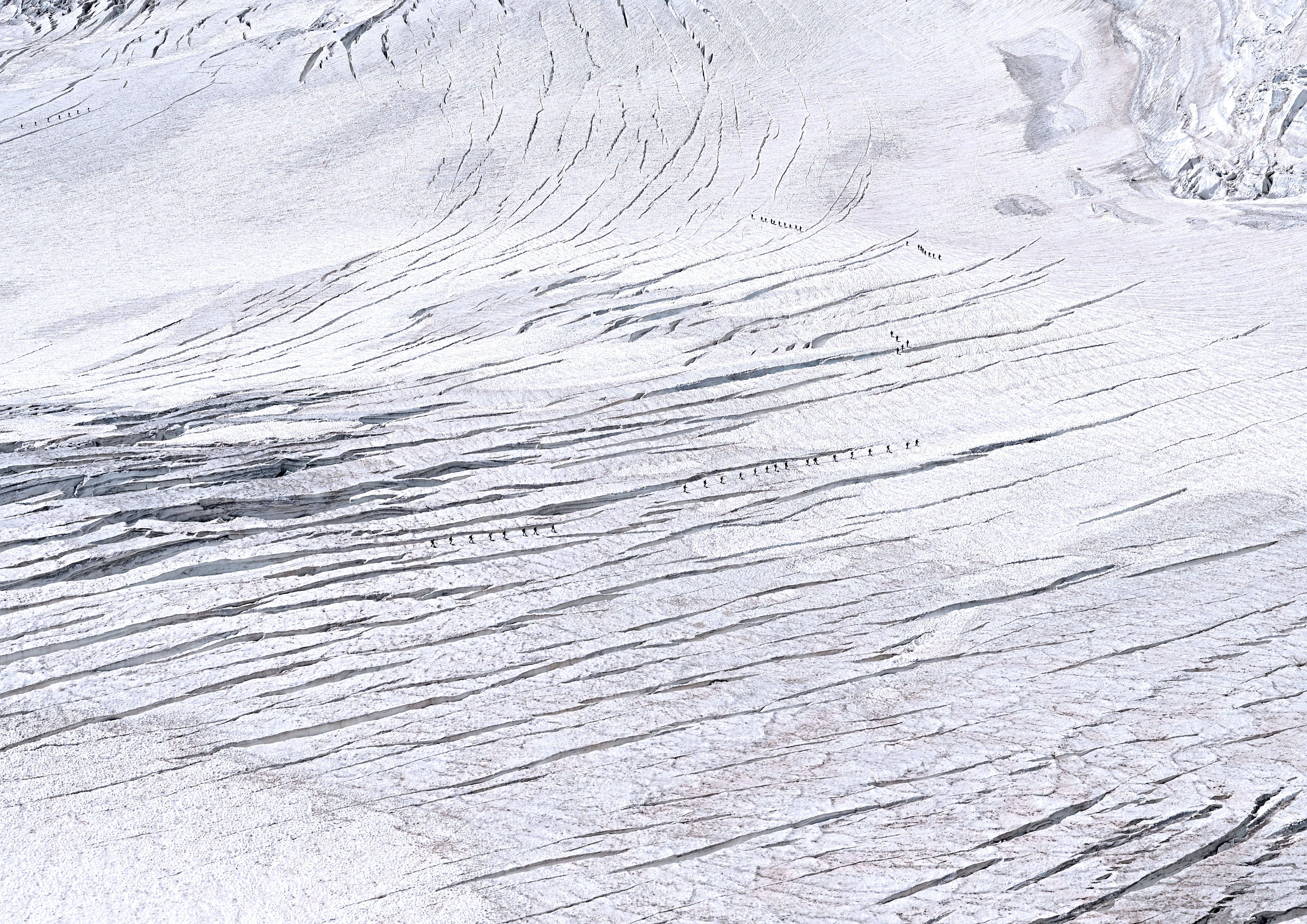 Aerial View of Snowy Alpine Terrain with Glacial Crevasses · Free Stock ...