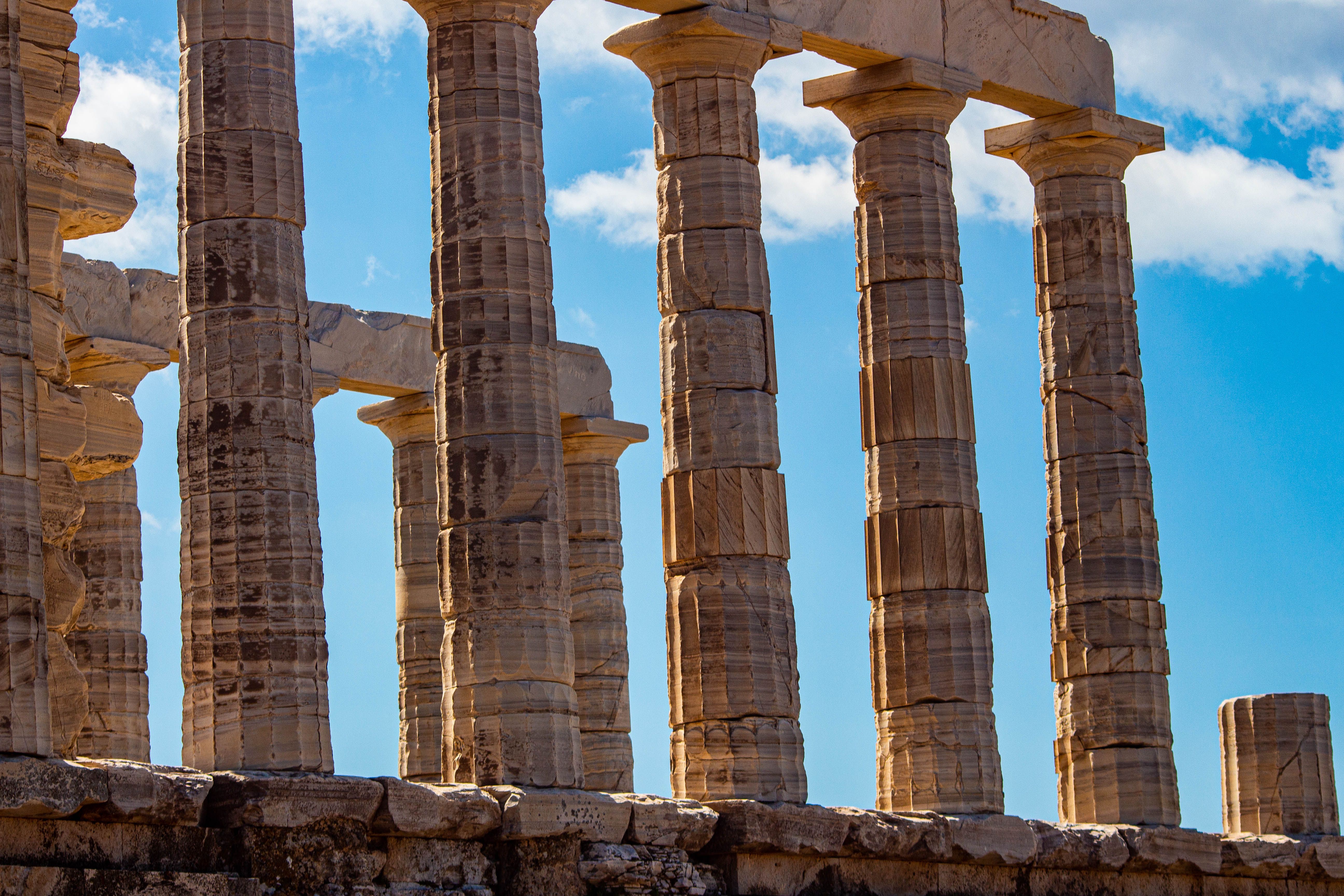 Ancient Greek Temple Columns Against Blue Sky · Free Stock Photo