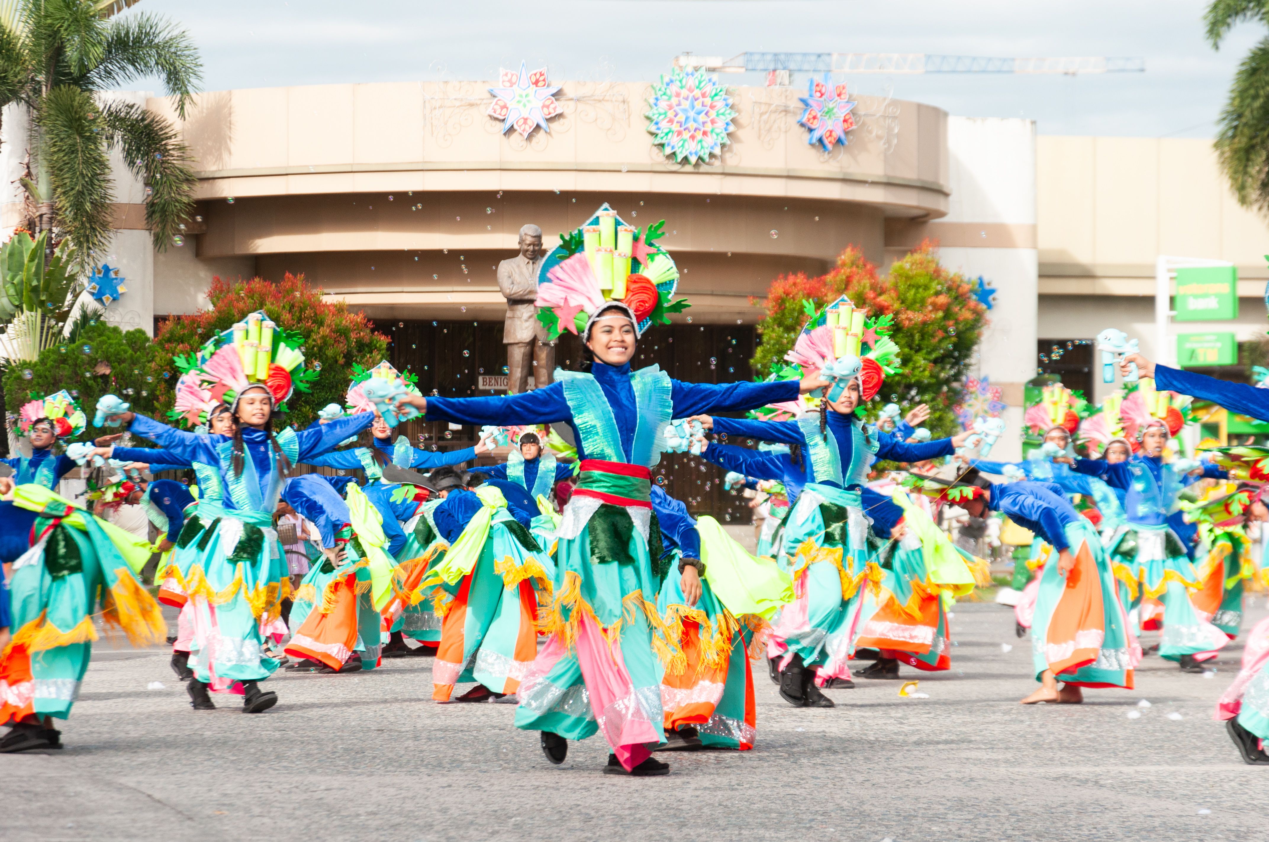 Vibrant Street Parade with Colorful Dancers · Free Stock Photo