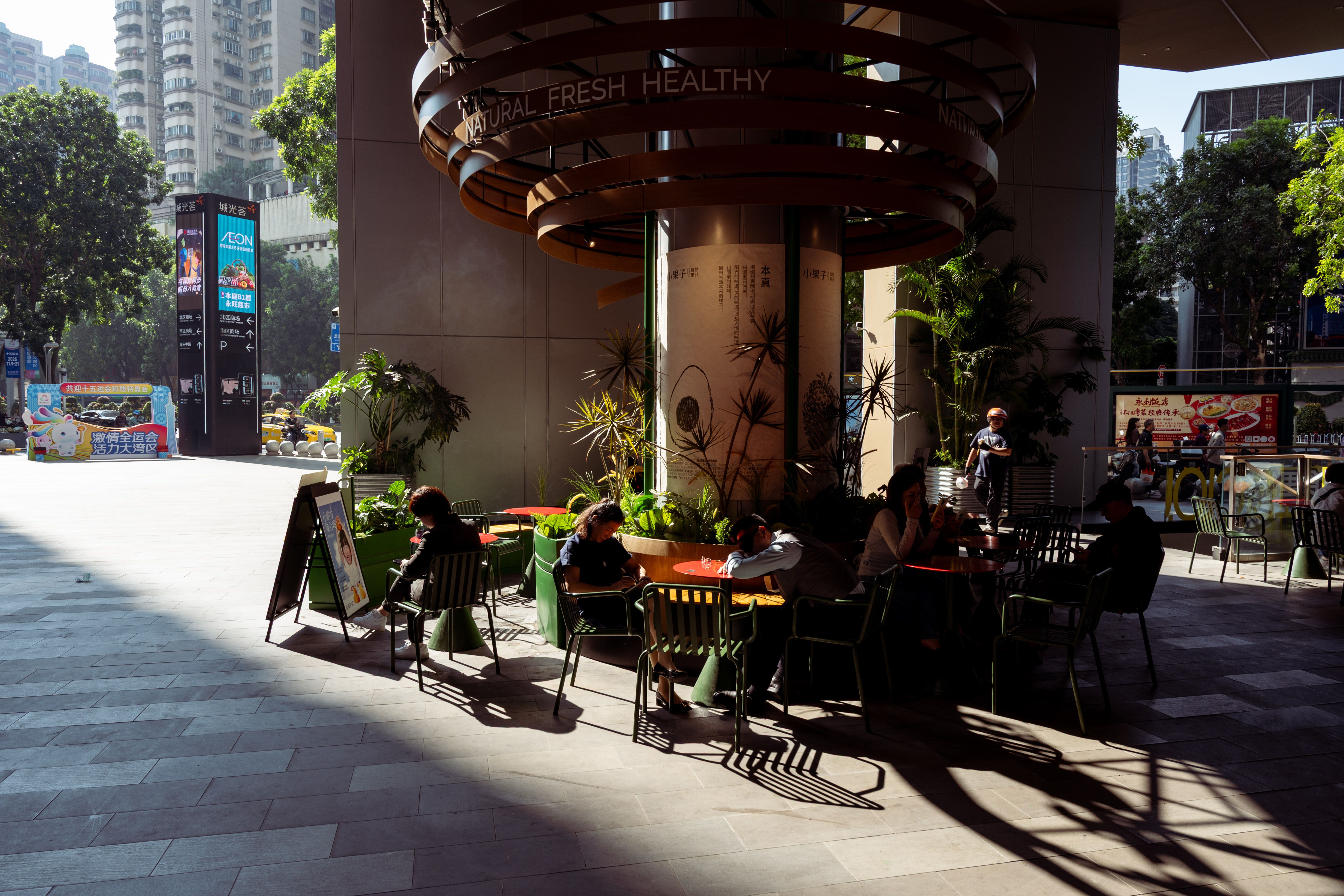 Urban Cafe Scene in Guangzhou with Natural Light · Free Stock Photo