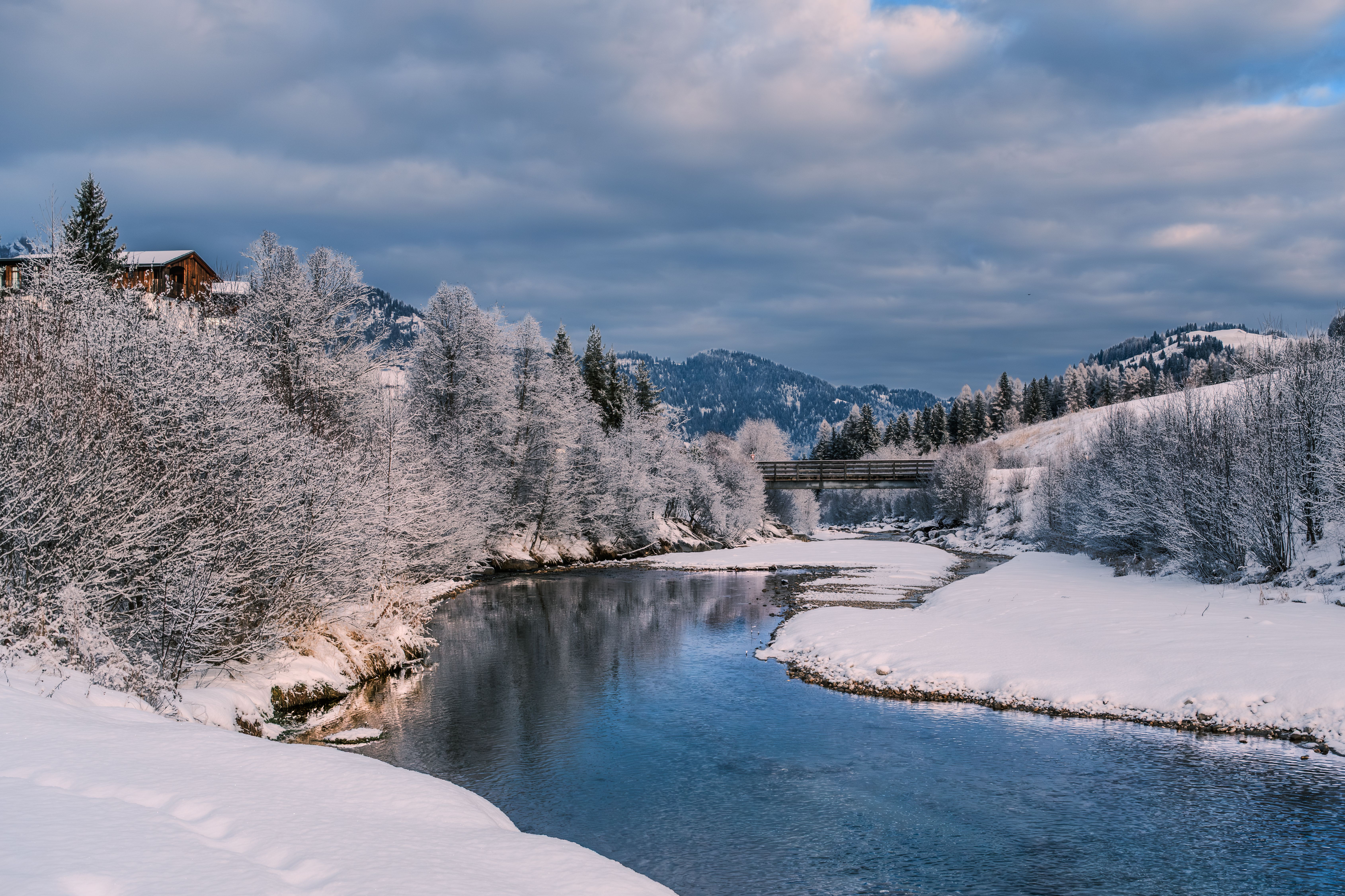 Scenic Winter Landscape with Snowy River and Trees · Free Stock Photo