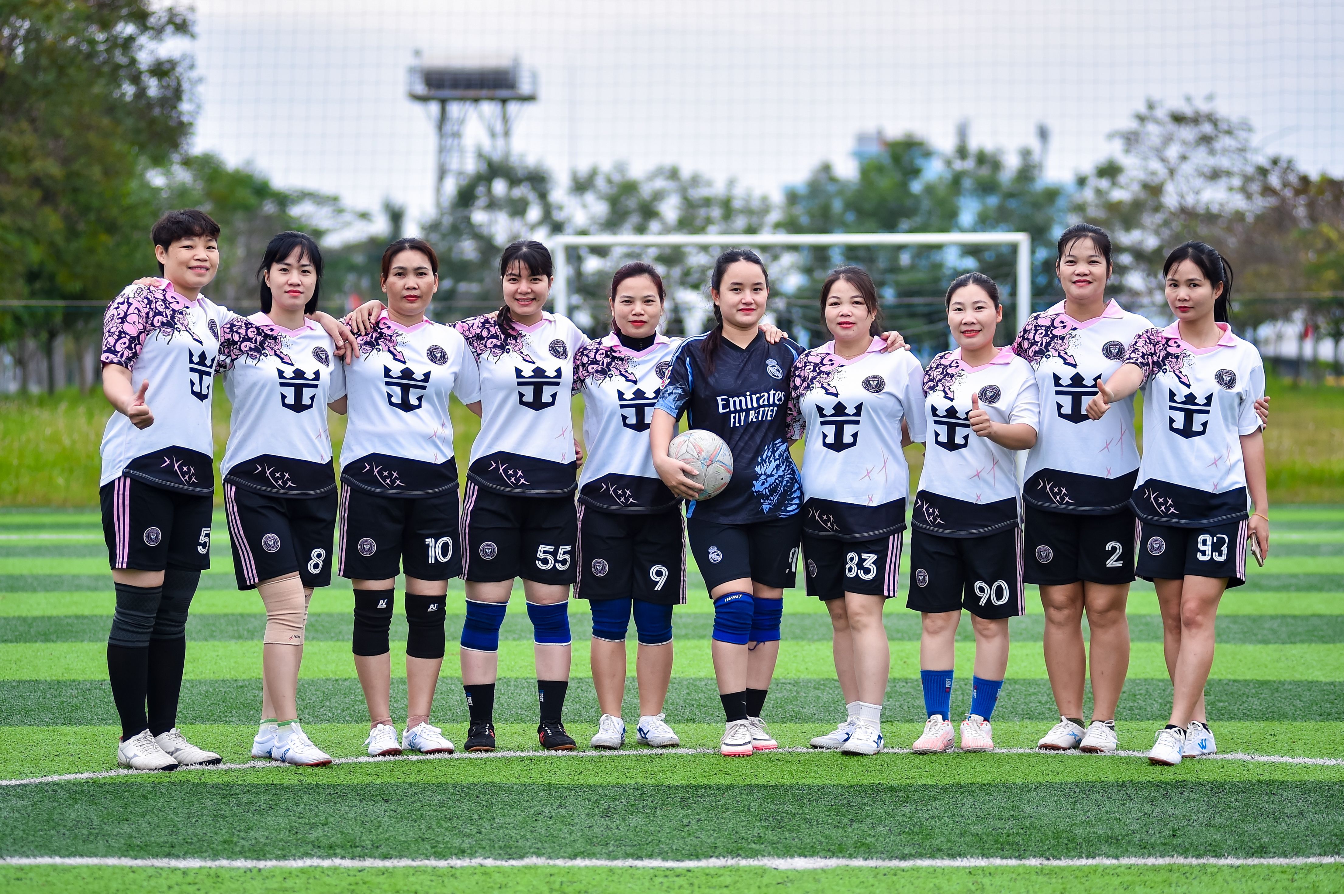 Women's Football Team Portrait on Hanoi Field · Free Stock Photo