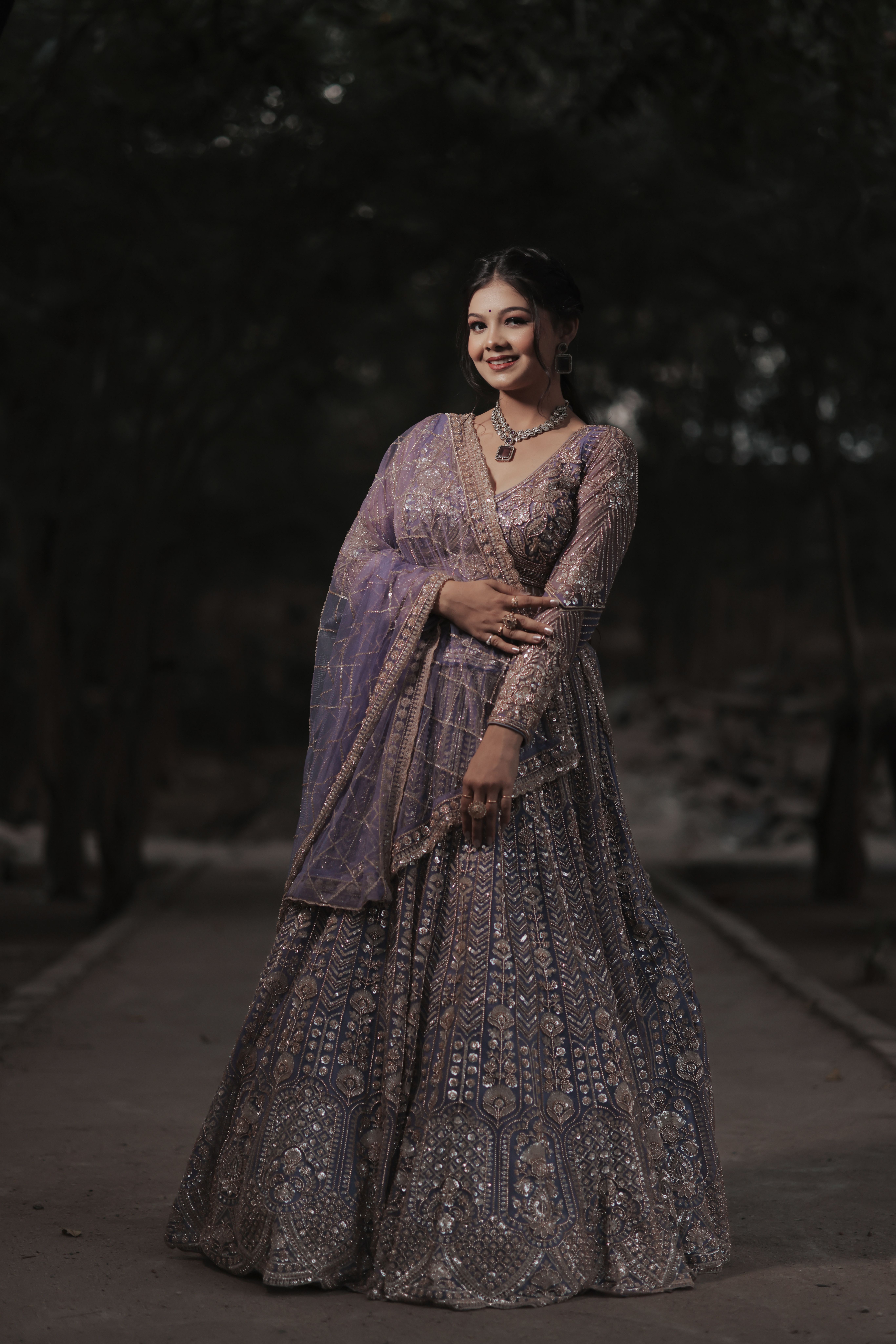 Elegant Portrait of a Smiling Bride in Ornate Attire · Free Stock Photo