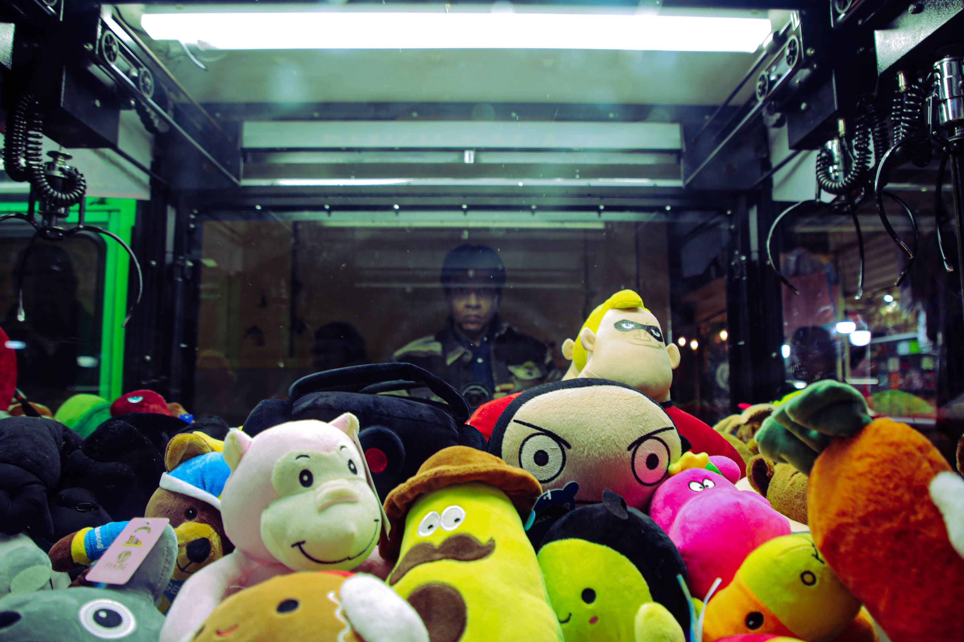 Colorful Plush Toys in Arcade Claw Machine · Free Stock Photo