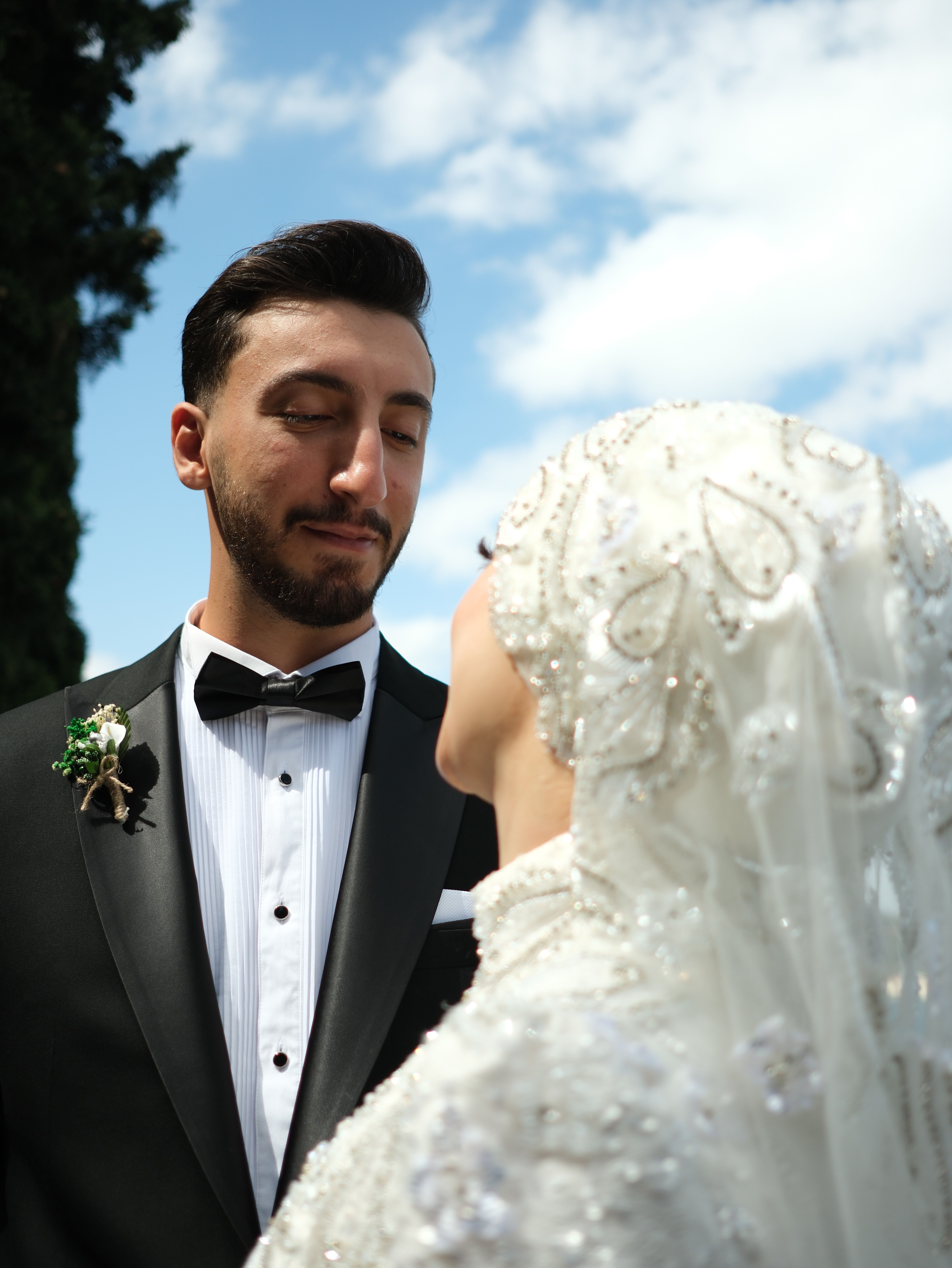 Elegant Outdoor Wedding Portrait Under Clear Sky · Free Stock Photo
