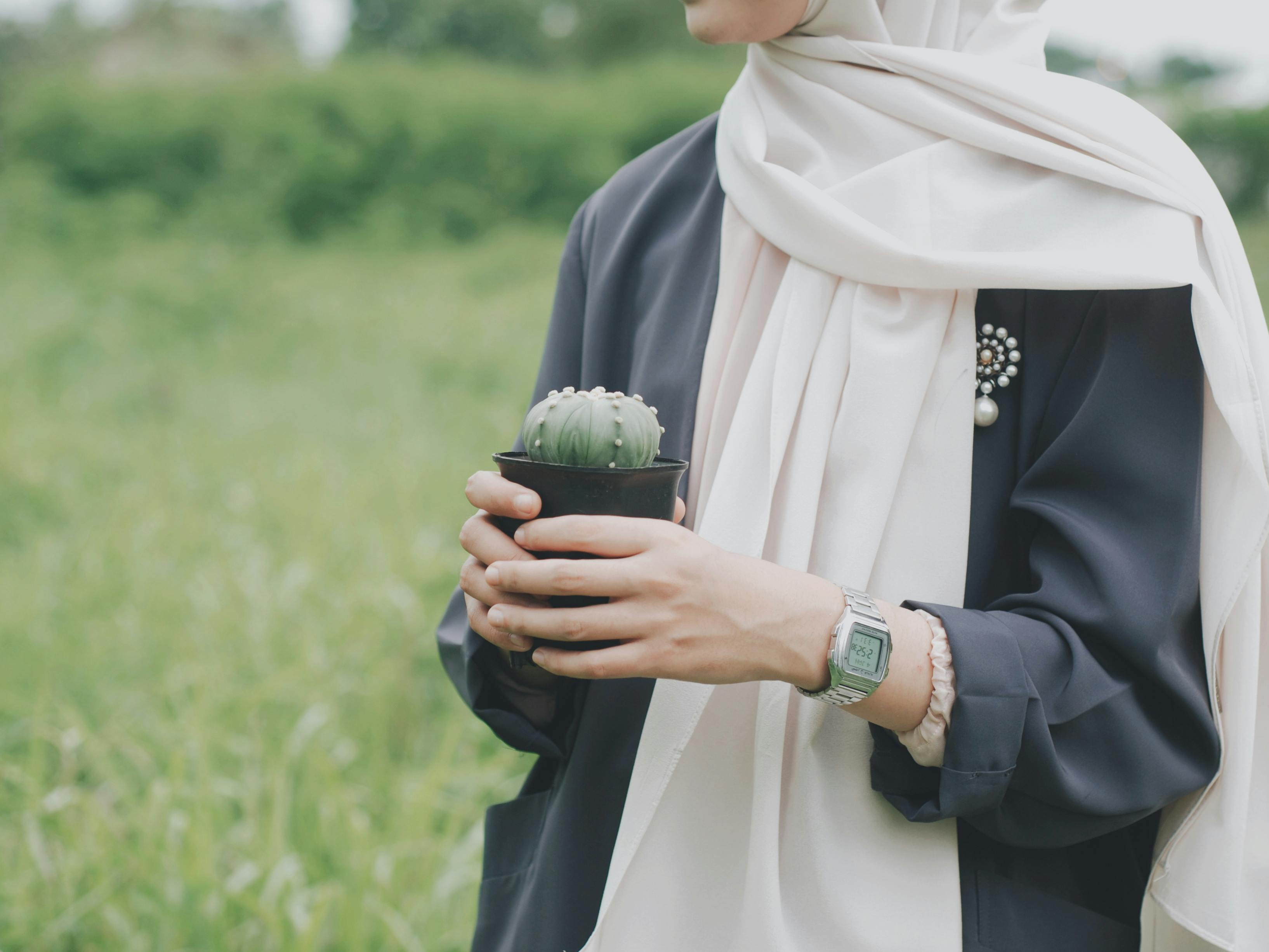 Woman Carrying Green Cactus Plant · Free Stock Photo