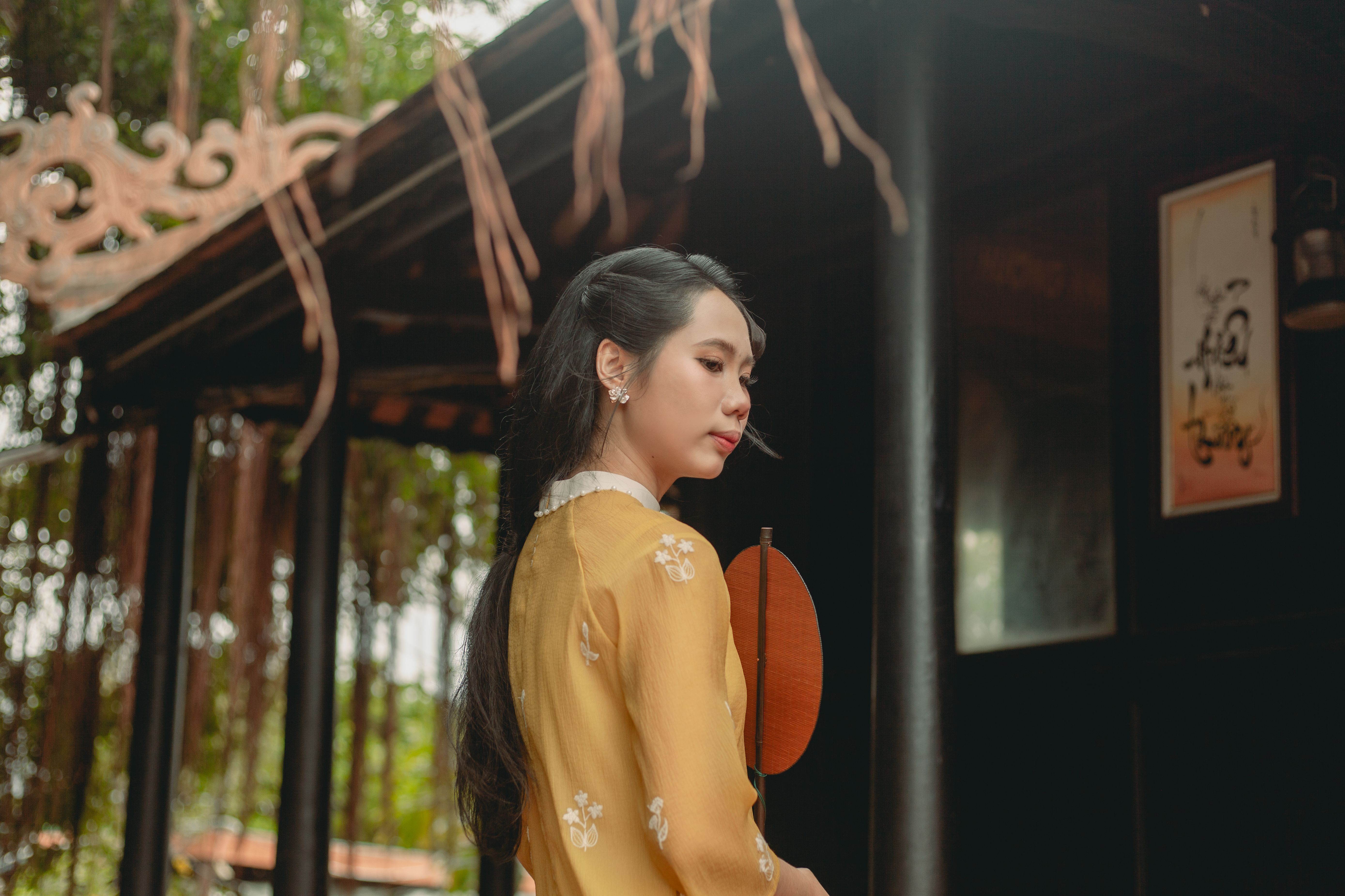 Portrait of Woman in Traditional Yellow Dress · Free Stock Photo