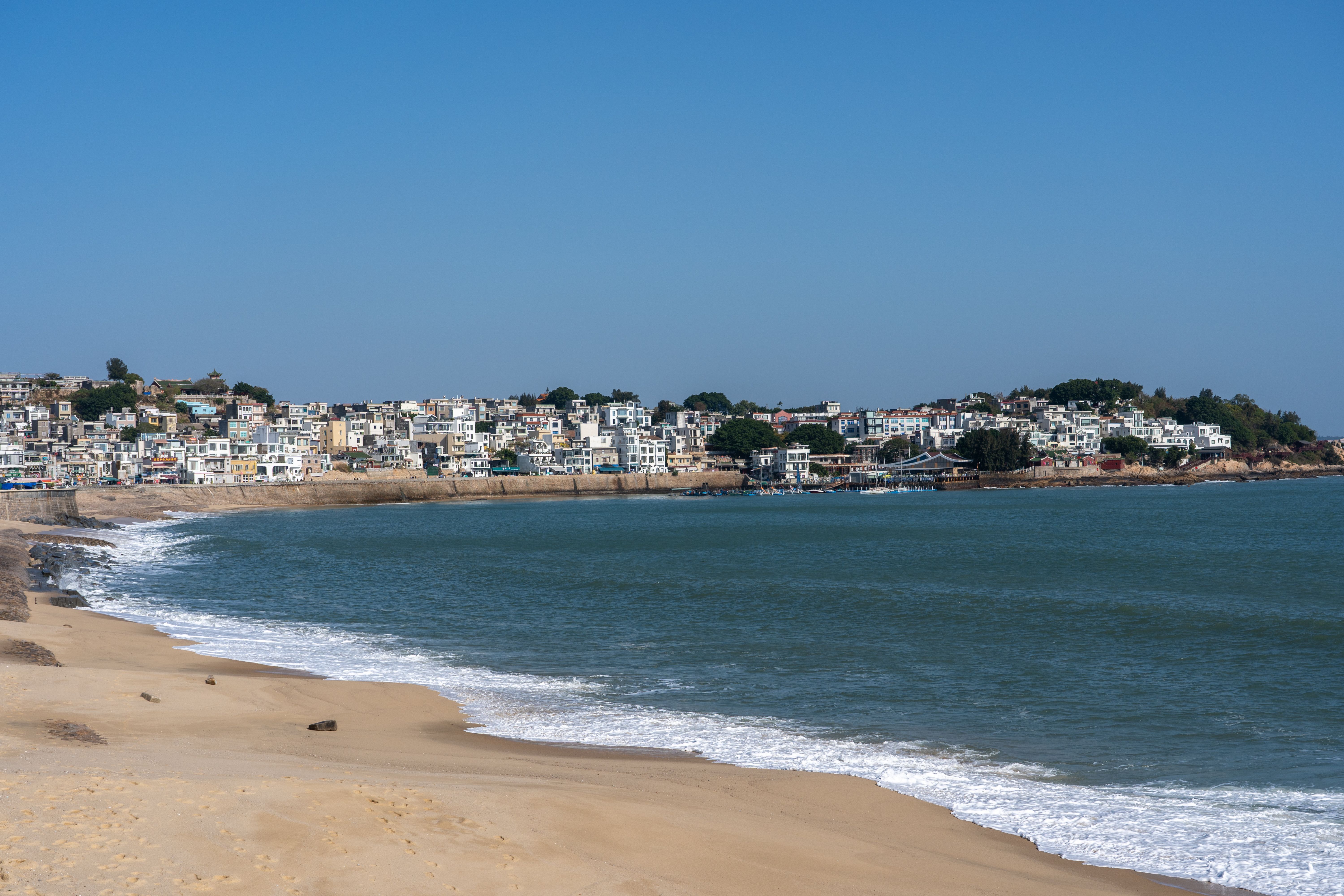 Scenic Coastal View of Quaint Seaside Town · Free Stock Photo