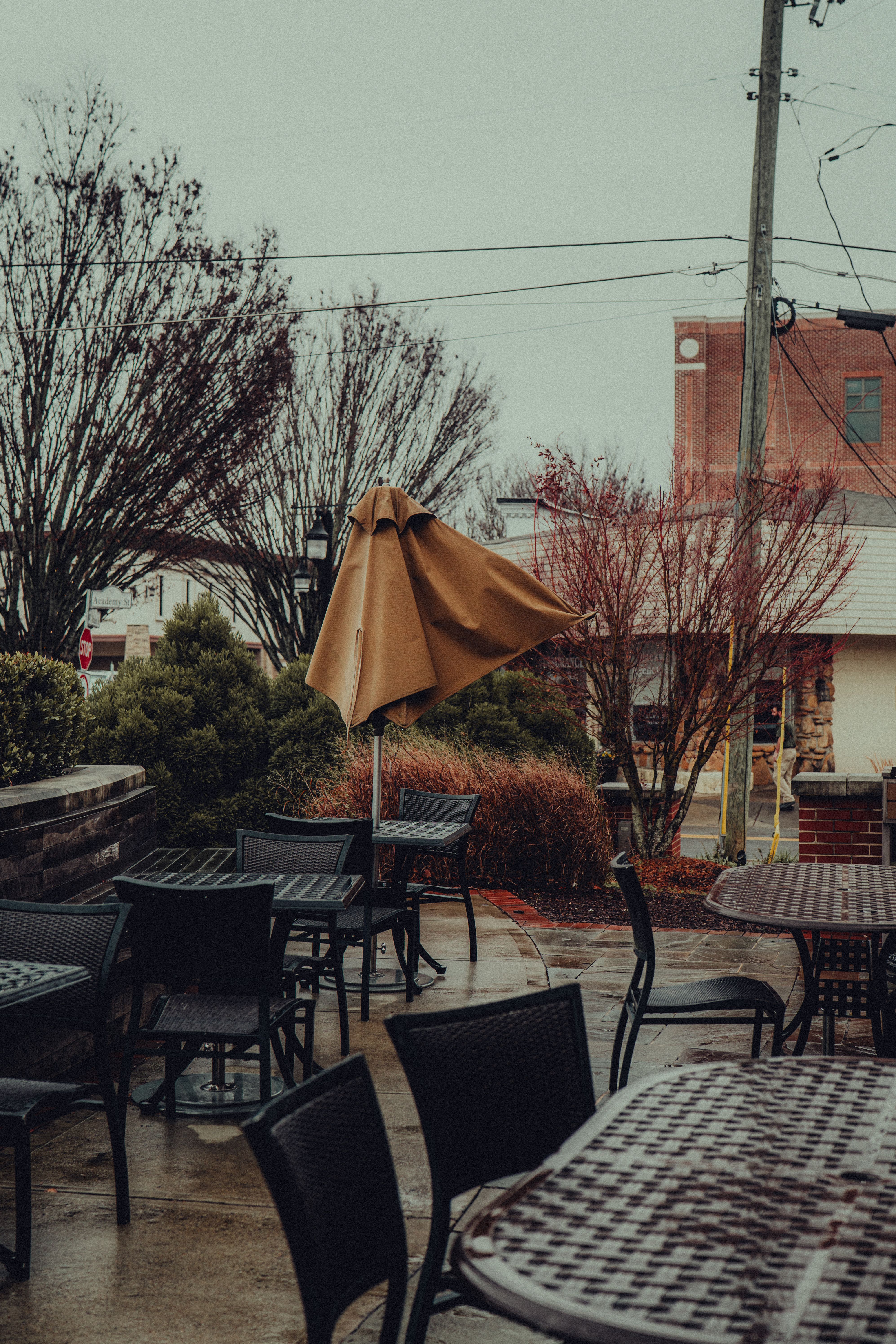 Moody Rainy Day at a Downtown Cafe · Free Stock Photo