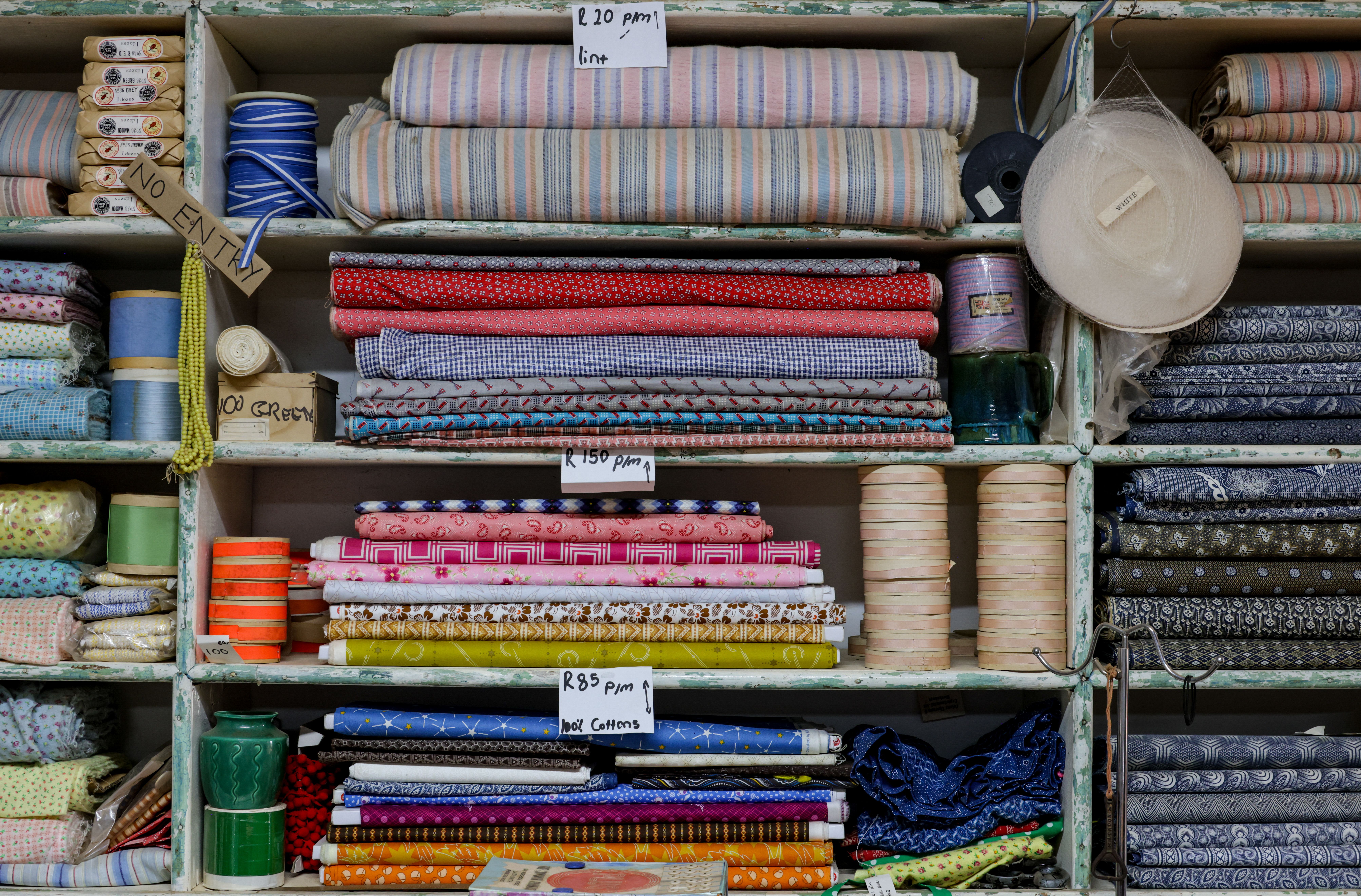 Colorful Fabric Shelf Display in Textile Store · Free Stock Photo