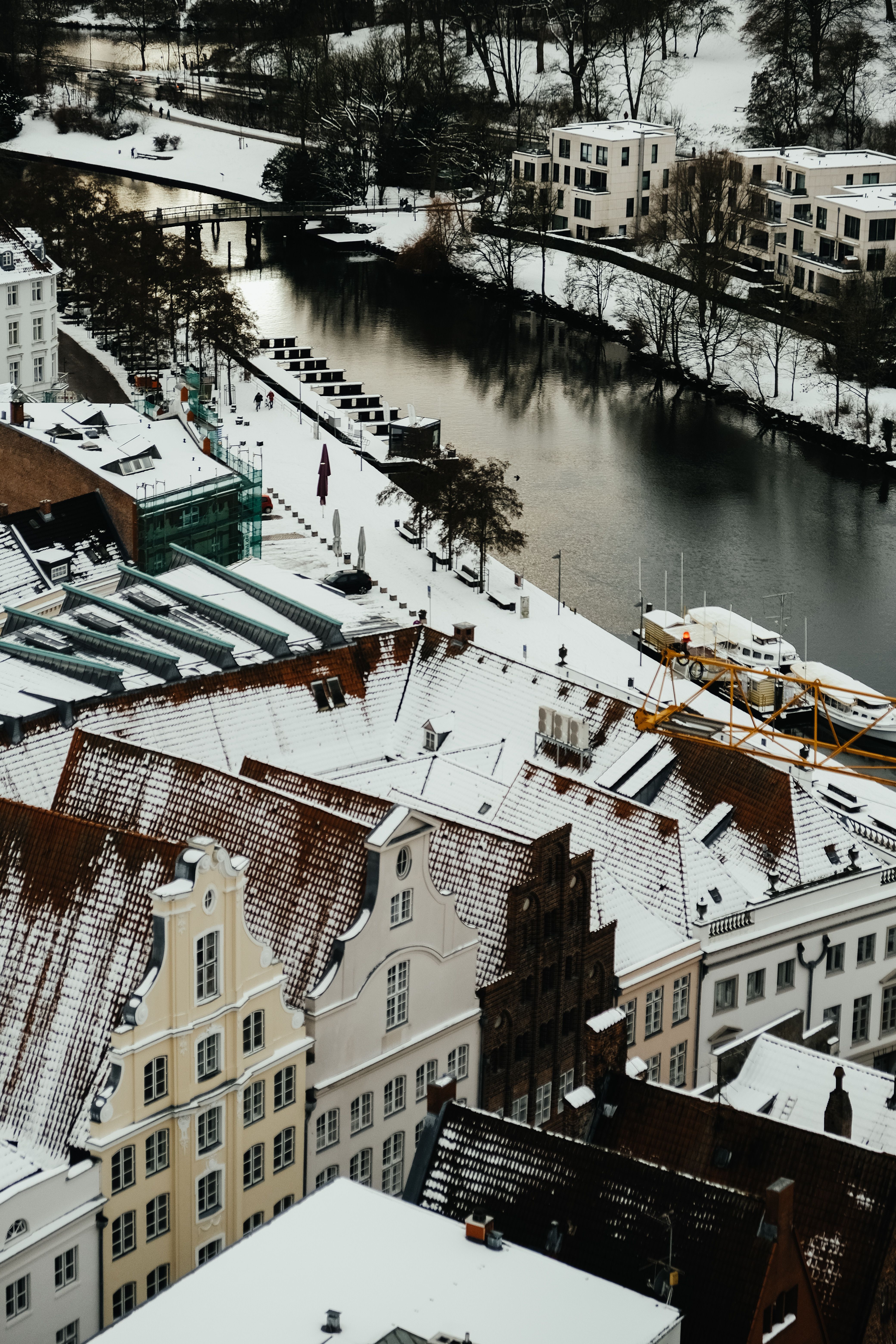 Aerial View of Snow-Covered European Cityscape · Free Stock Photo