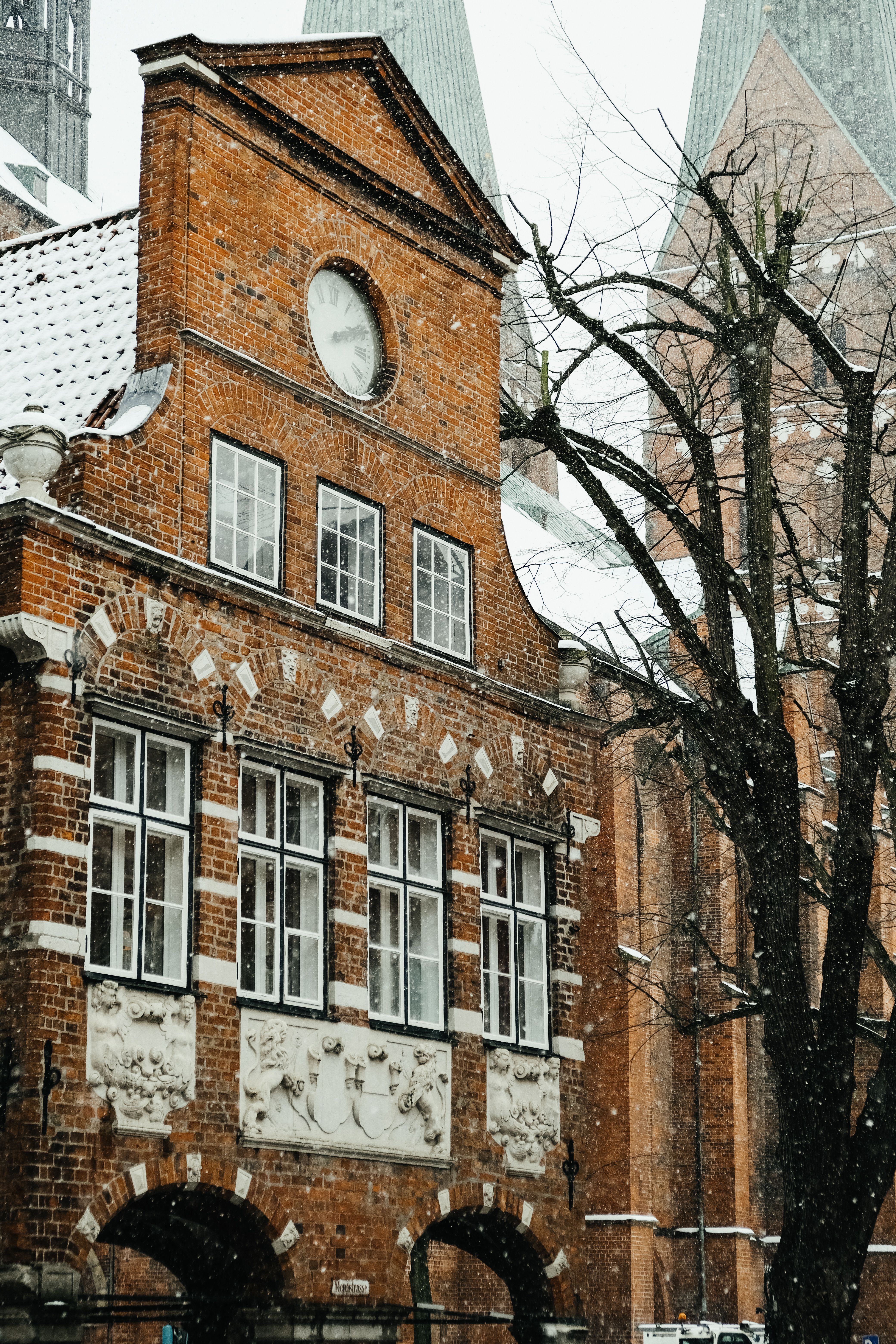 Historic Snowy Brick Building in Winter · Free Stock Photo