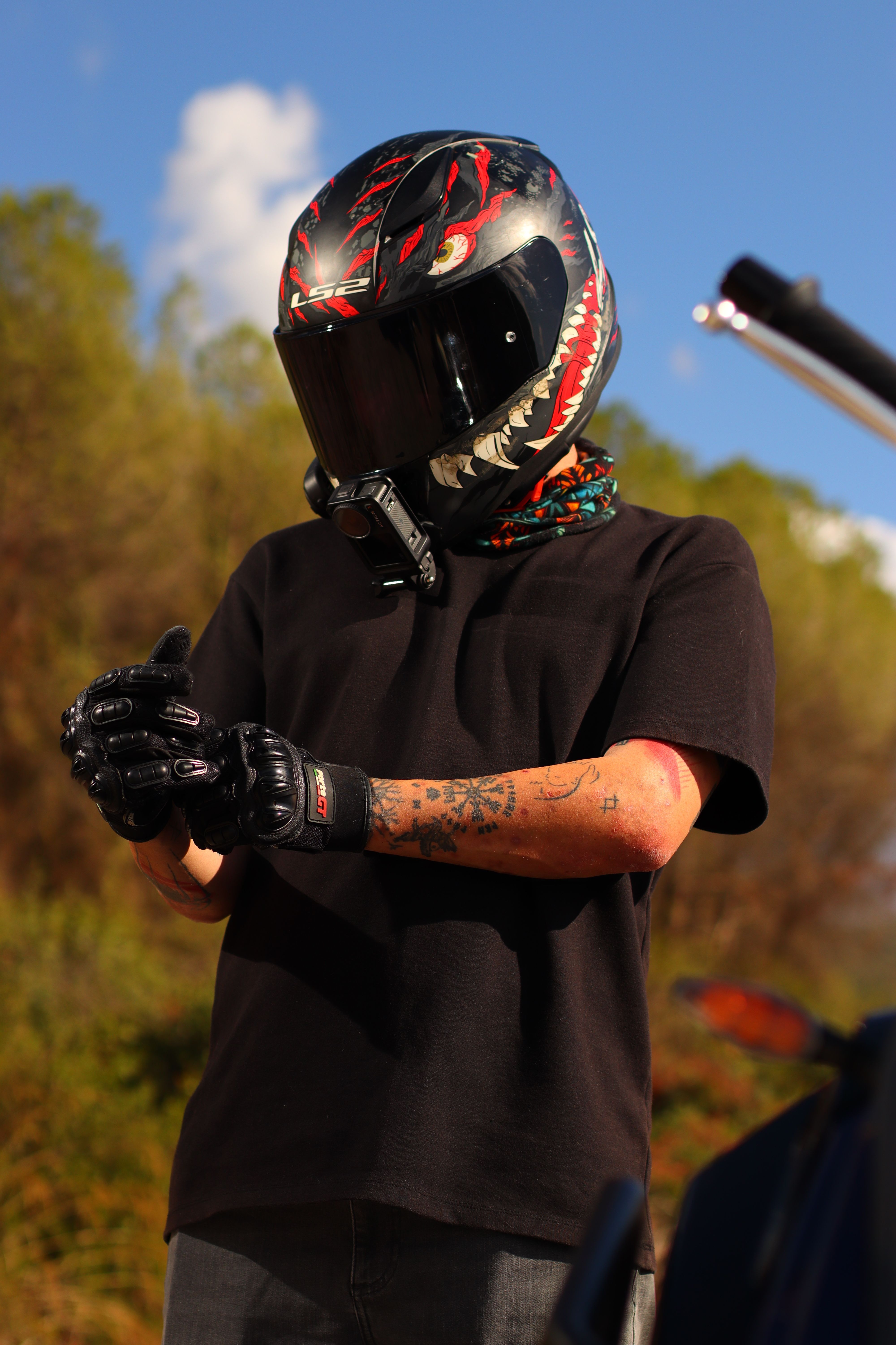 Motorcyclist with Dragon Helmet Outdoors · Free Stock Photo