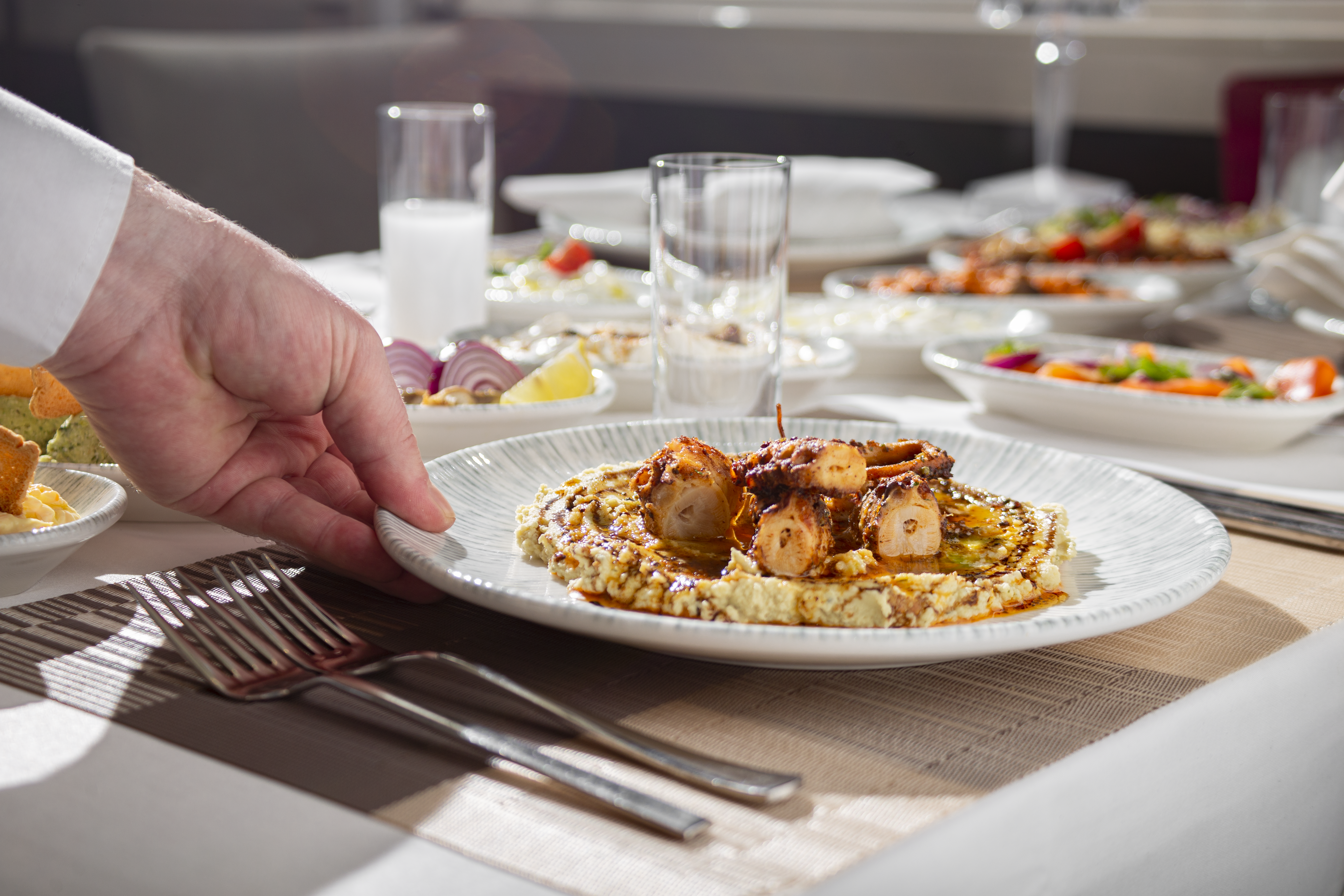 Gourmet Octopus Dish Served in a Restaurant · Free Stock Photo