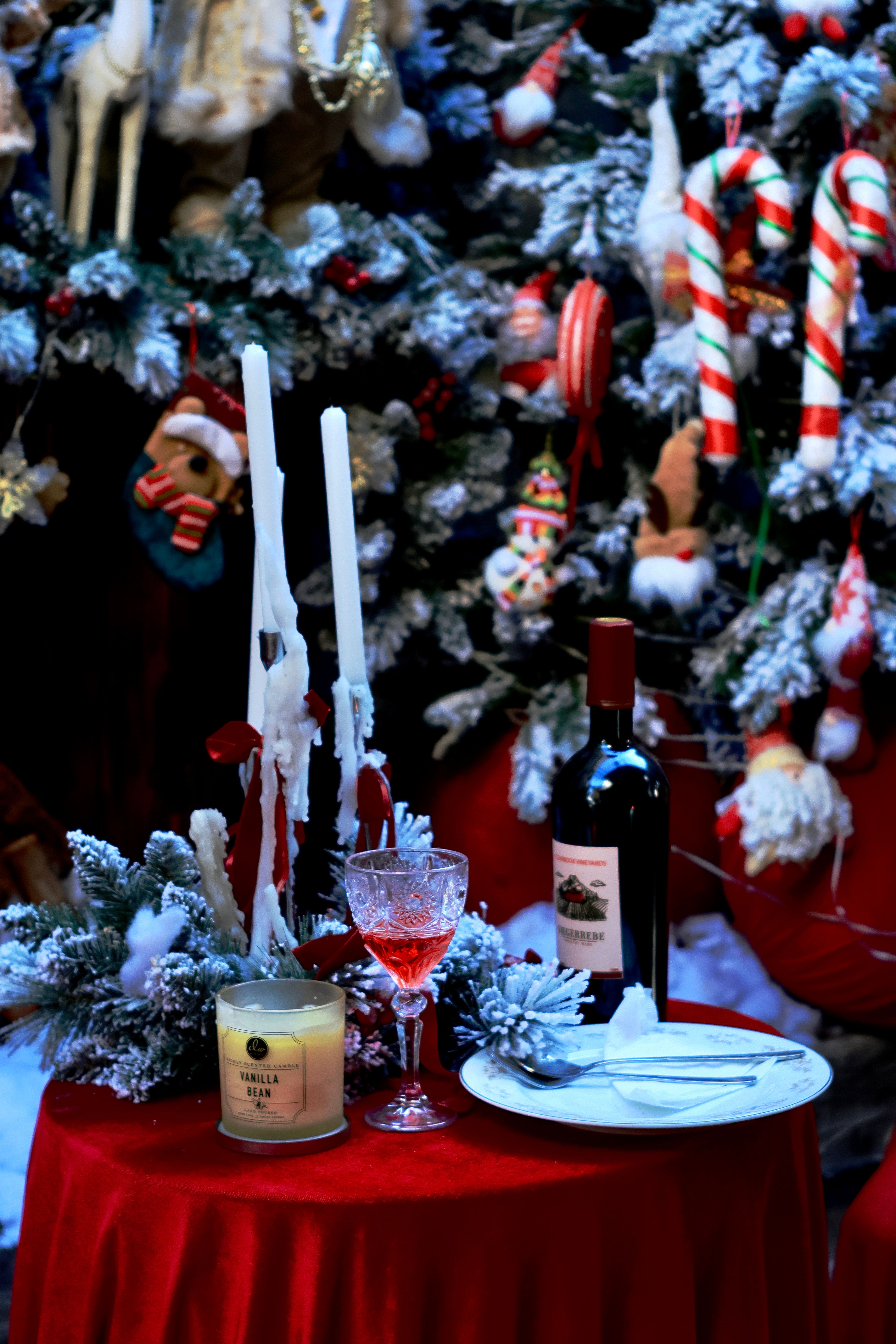 Festive Christmas Table Setting with Wine and Decor · Free Stock Photo