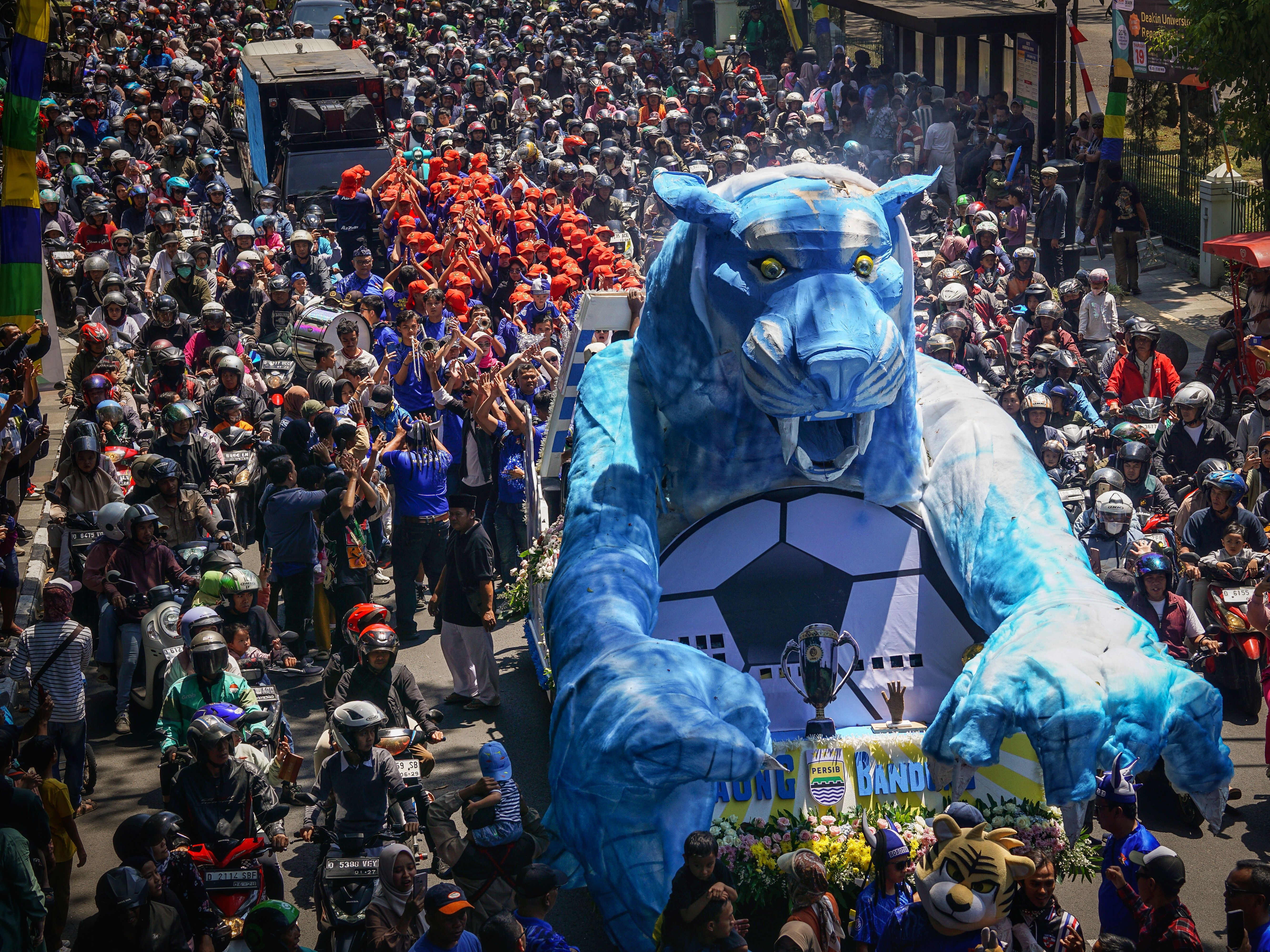 Colorful Parade with Blue Tiger Float in Bandung · Free Stock Photo